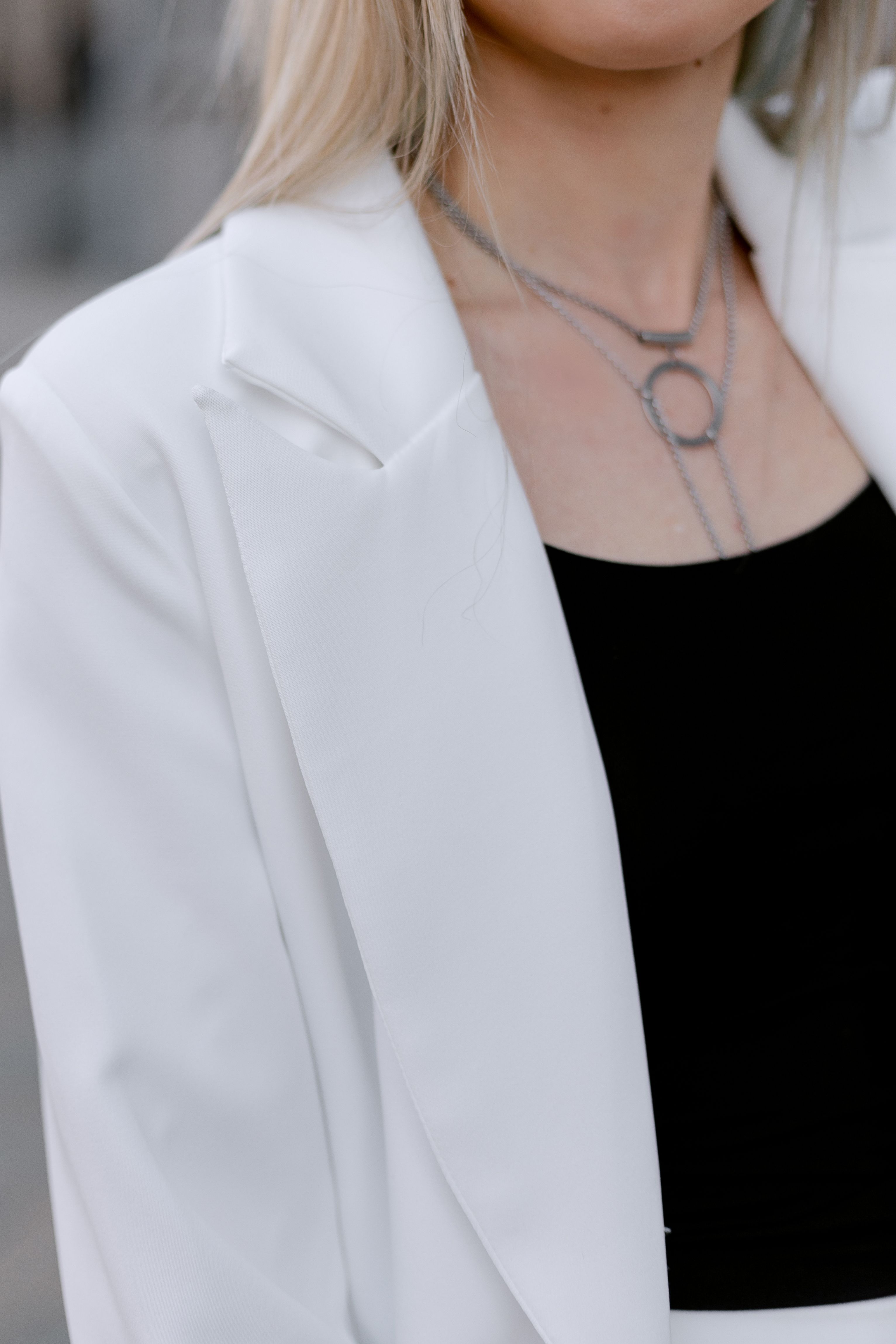 Close-Up Shot of a Person Wearing White Blazer · Free Stock Photo