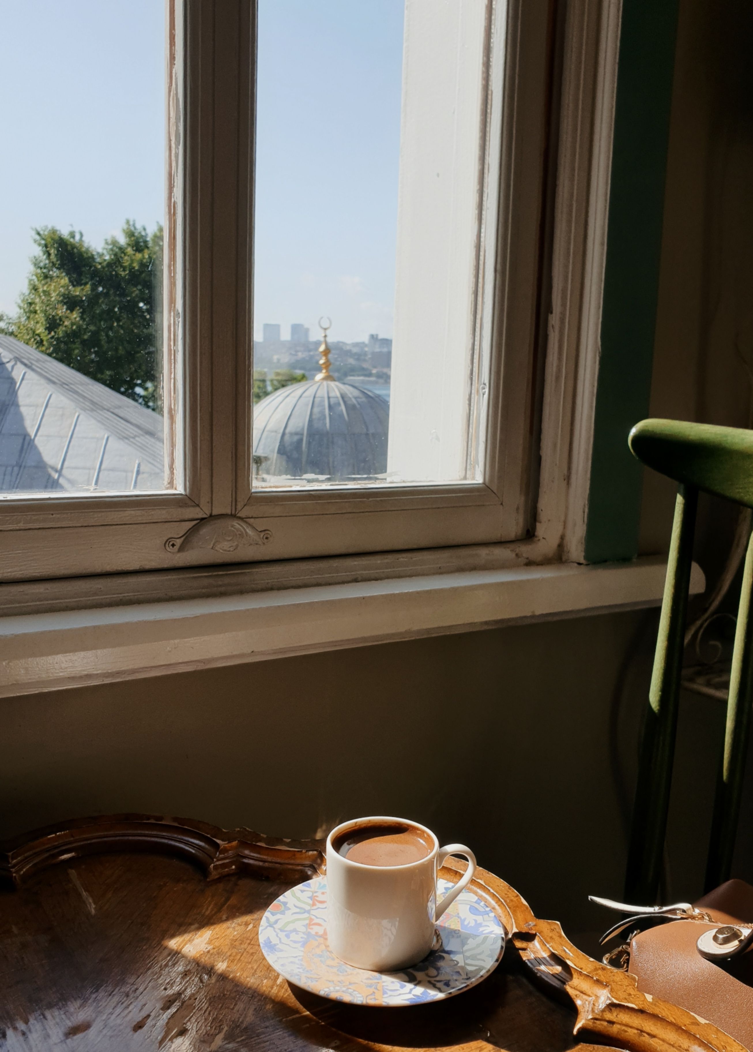 A Woman Drinking Coffee by the Window · Free Stock Photo