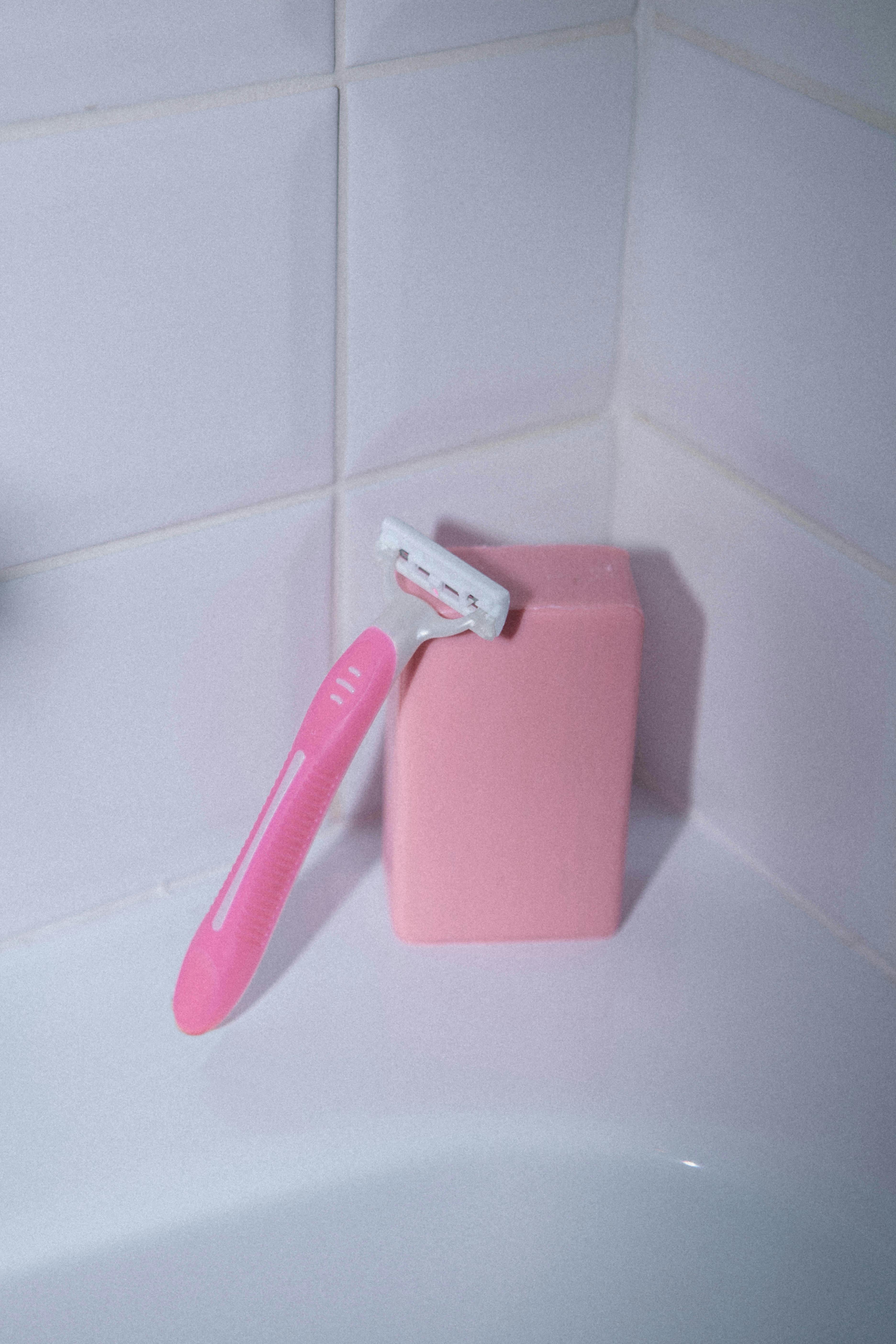 A Shaving Razor Leaning on a Soap · Free Stock Photo