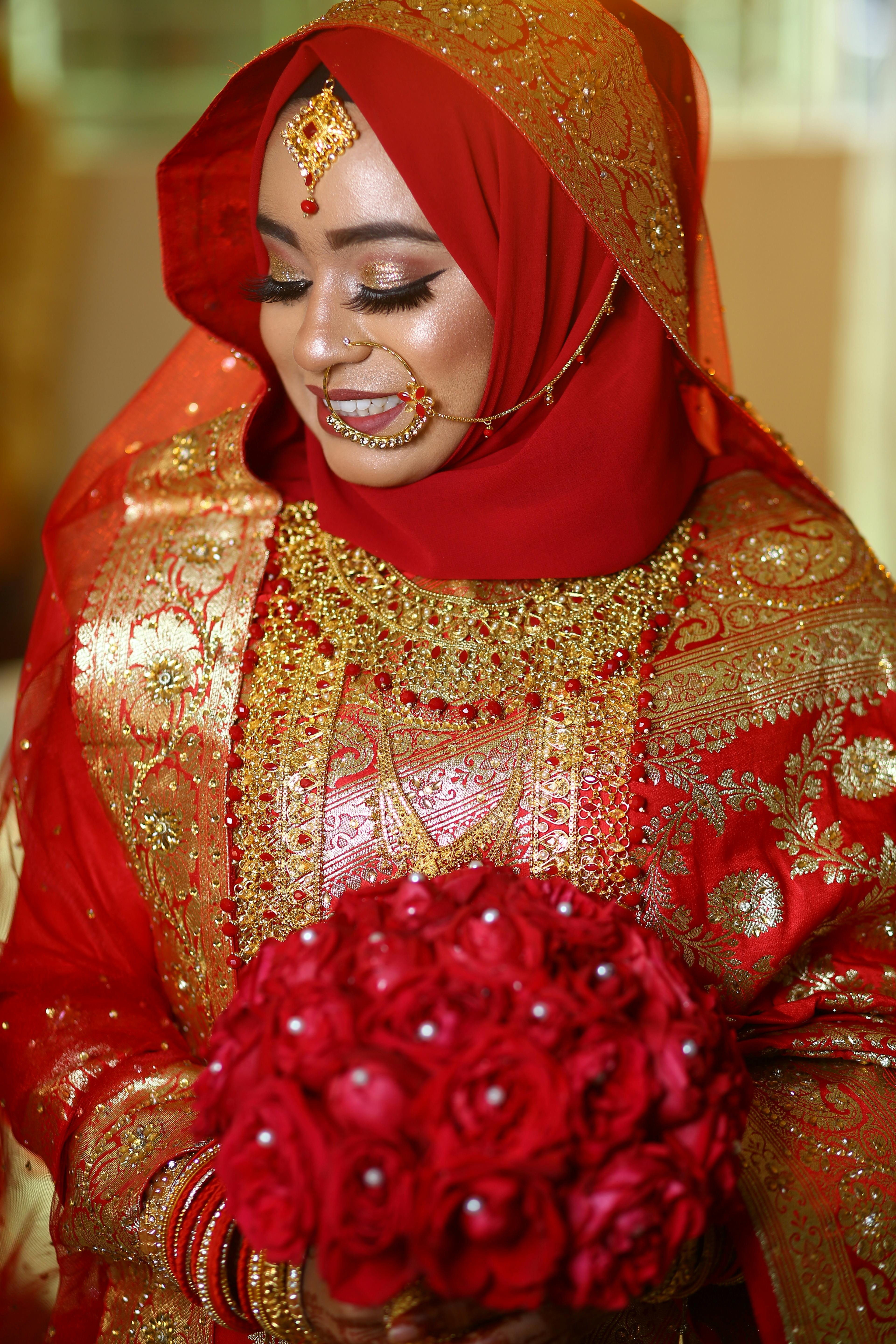 A Woman in Red and Gold Hijab · Free Stock Photo