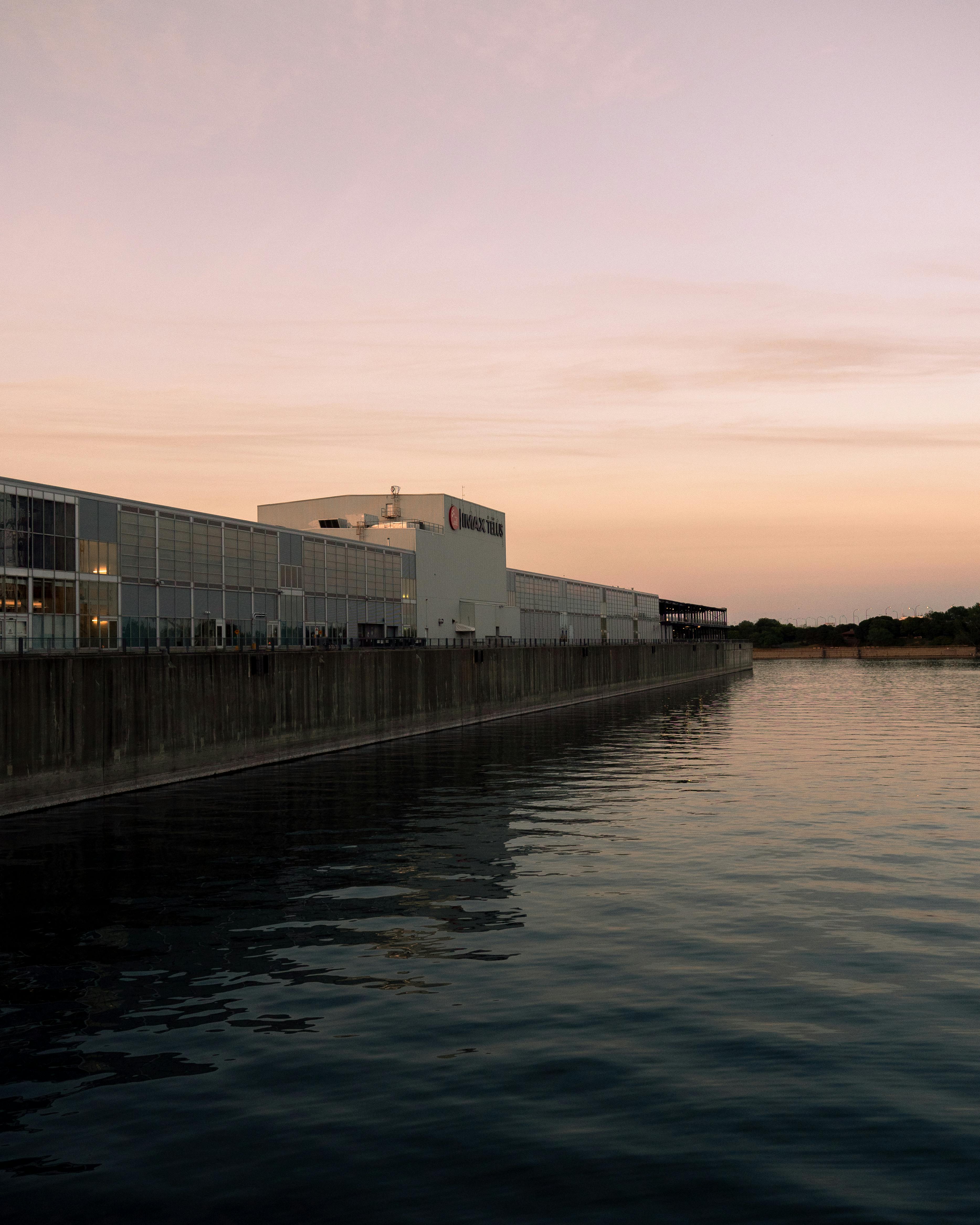 Modern Building near Sea at Sunset · Free Stock Photo