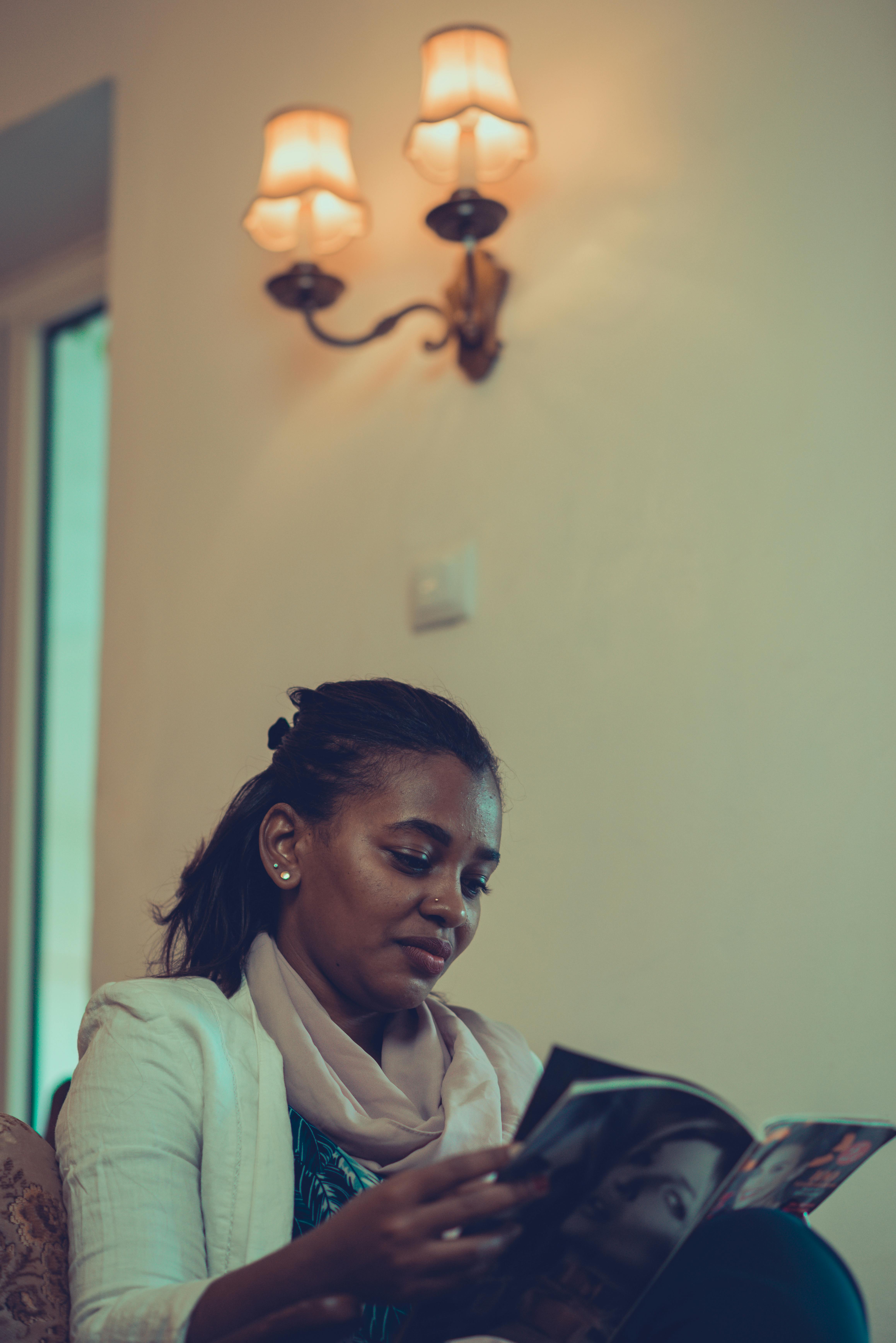 A Woman Reading a Magazine · Free Stock Photo