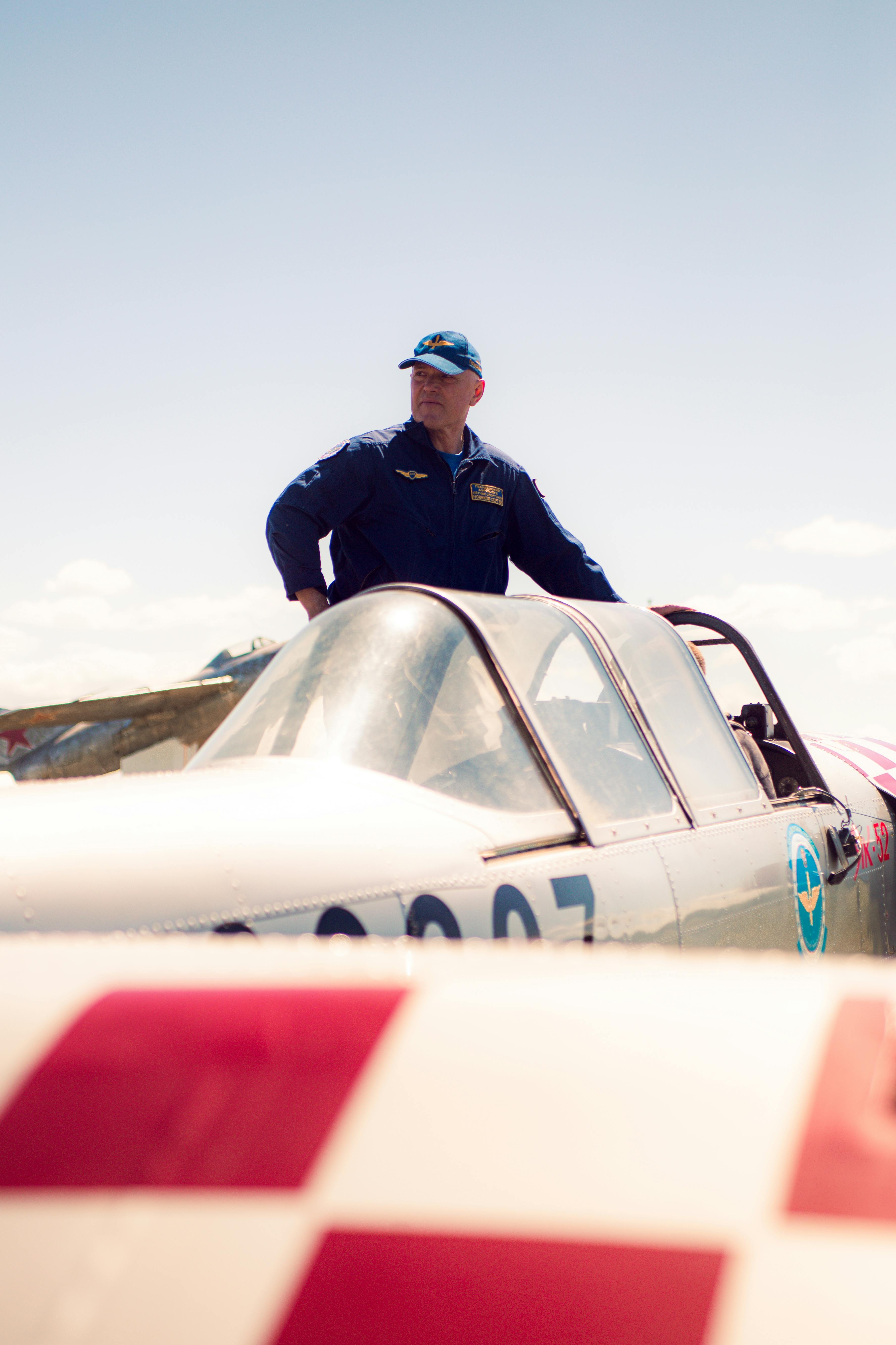 Pilot in Cockpit seen through Cracked Doors · Free Stock Photo