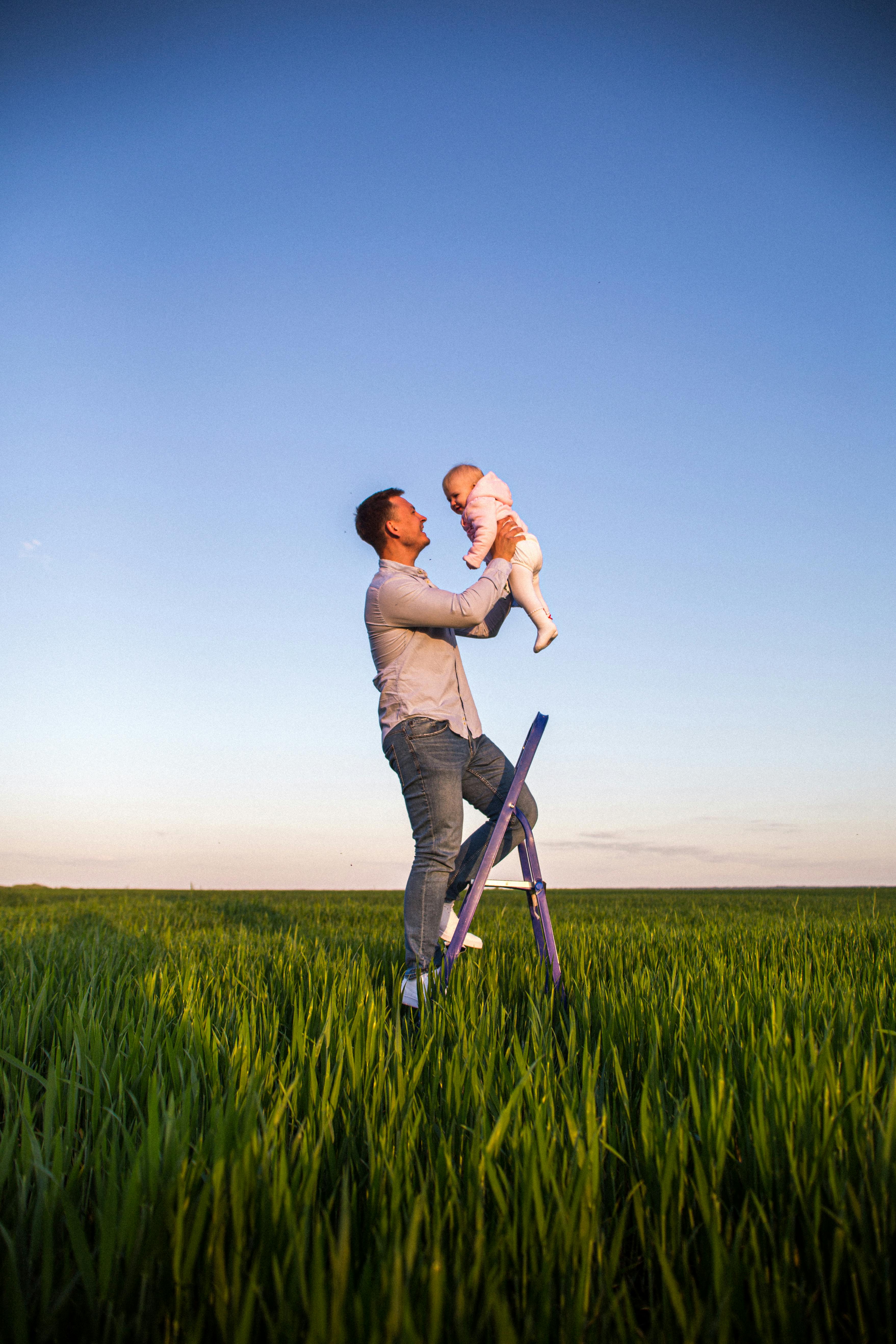 Child in Father Arms · Free Stock Photo