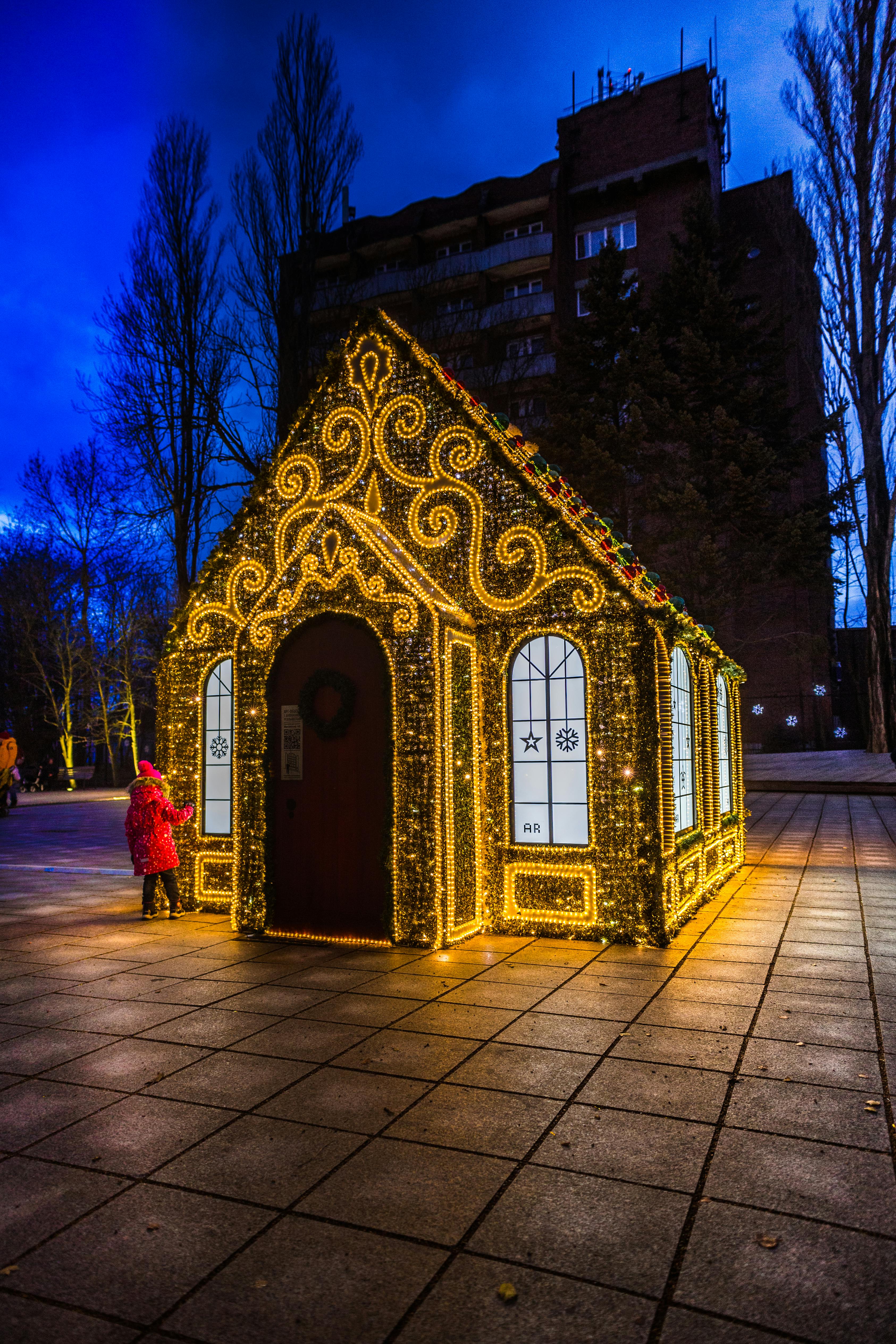 Illuminated Structure Near the Building · Free Stock Photo