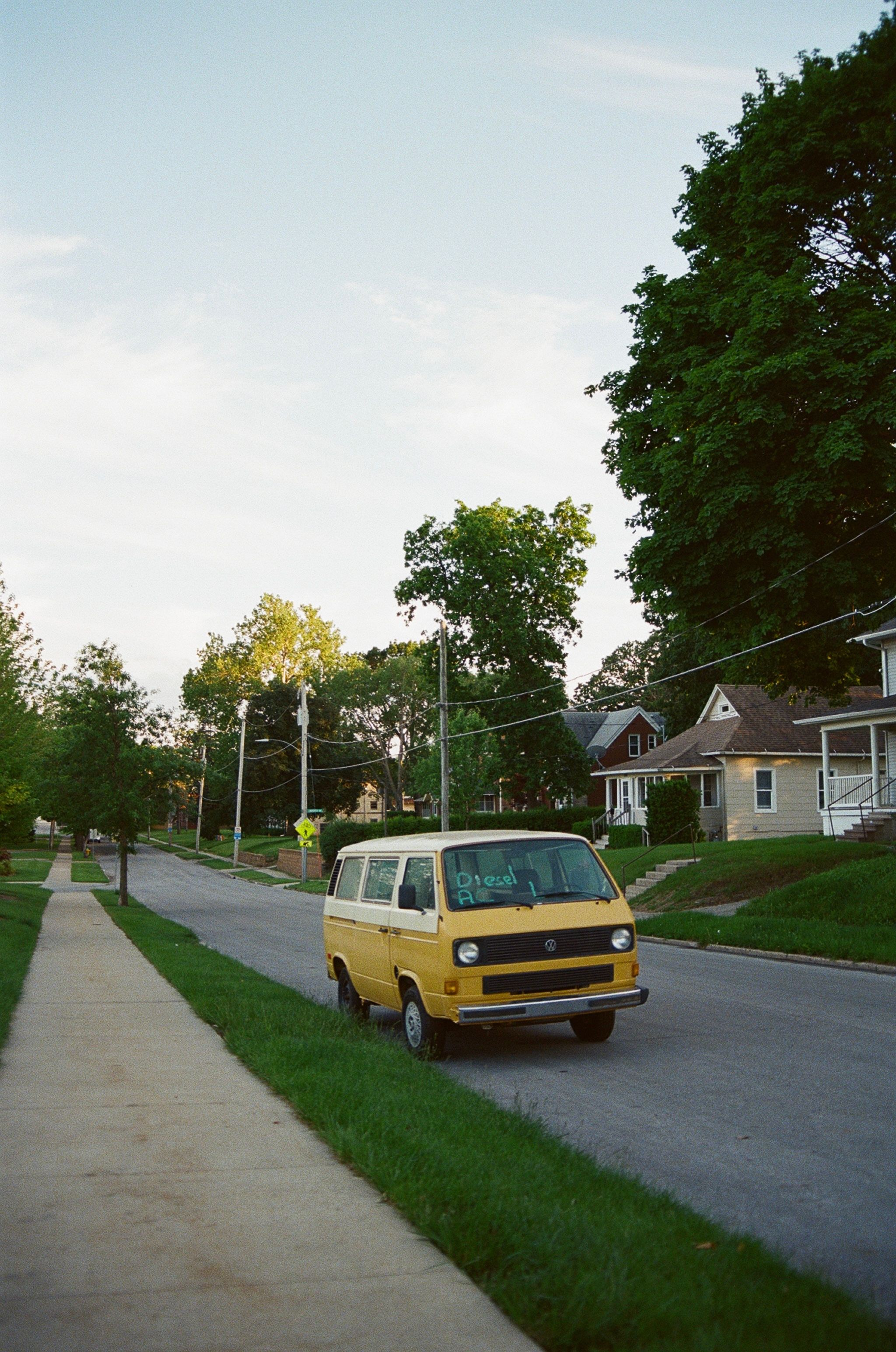 Yellow Van Parked on the Side of the Road · Free Stock Photo