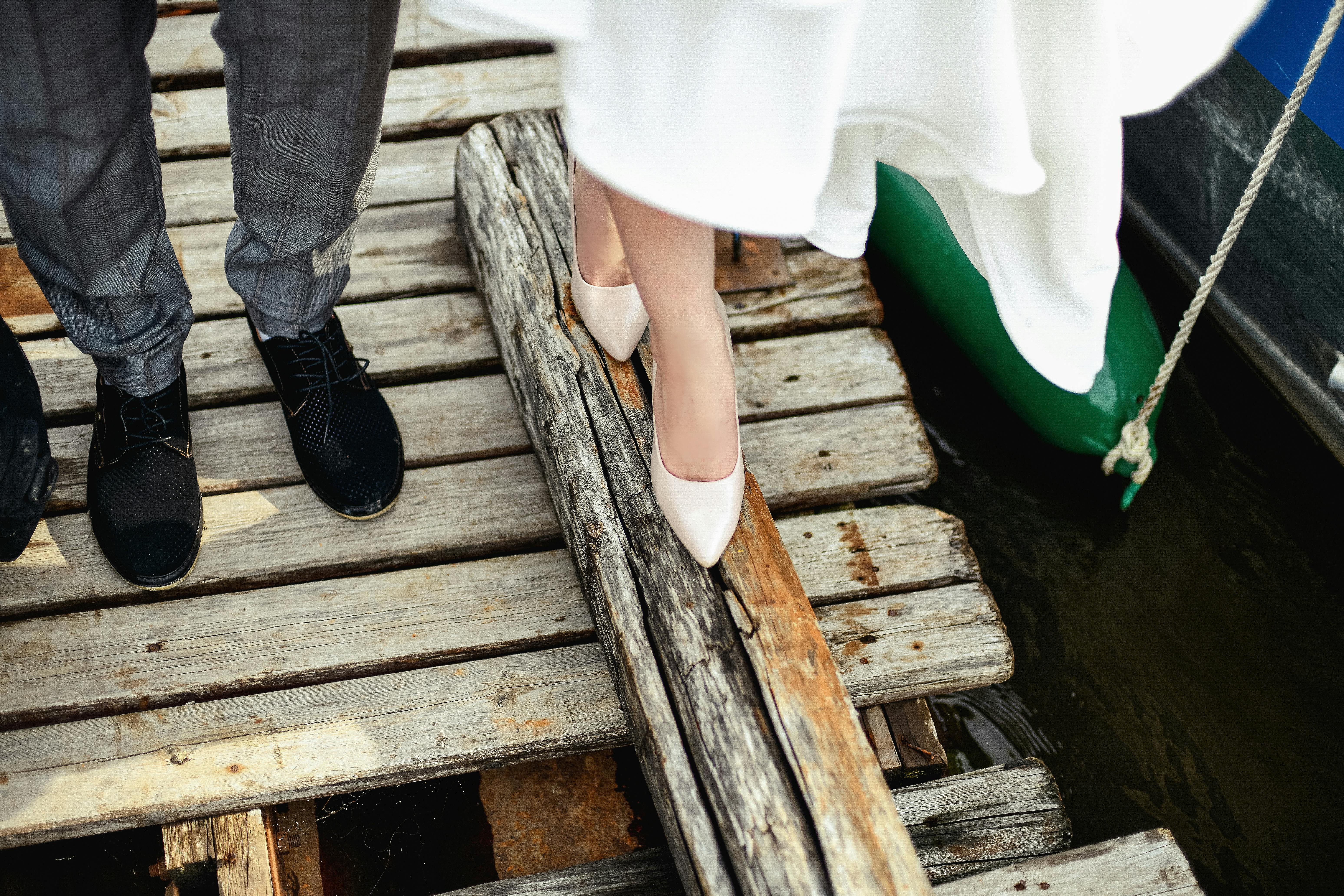 Two People Standing on a Pier · Free Stock Photo