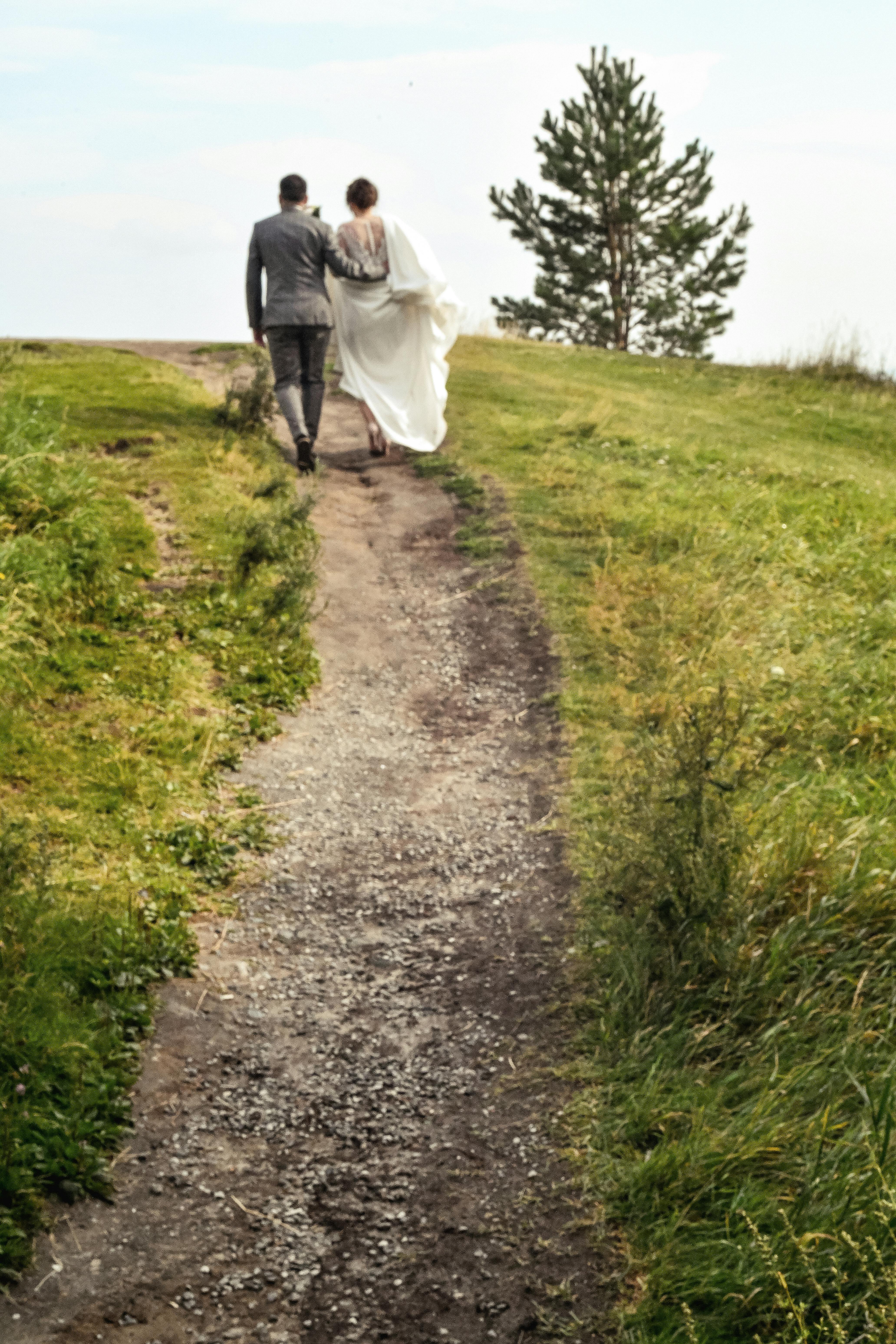 A Couple Walking on Dirt Walk Path · Free Stock Photo