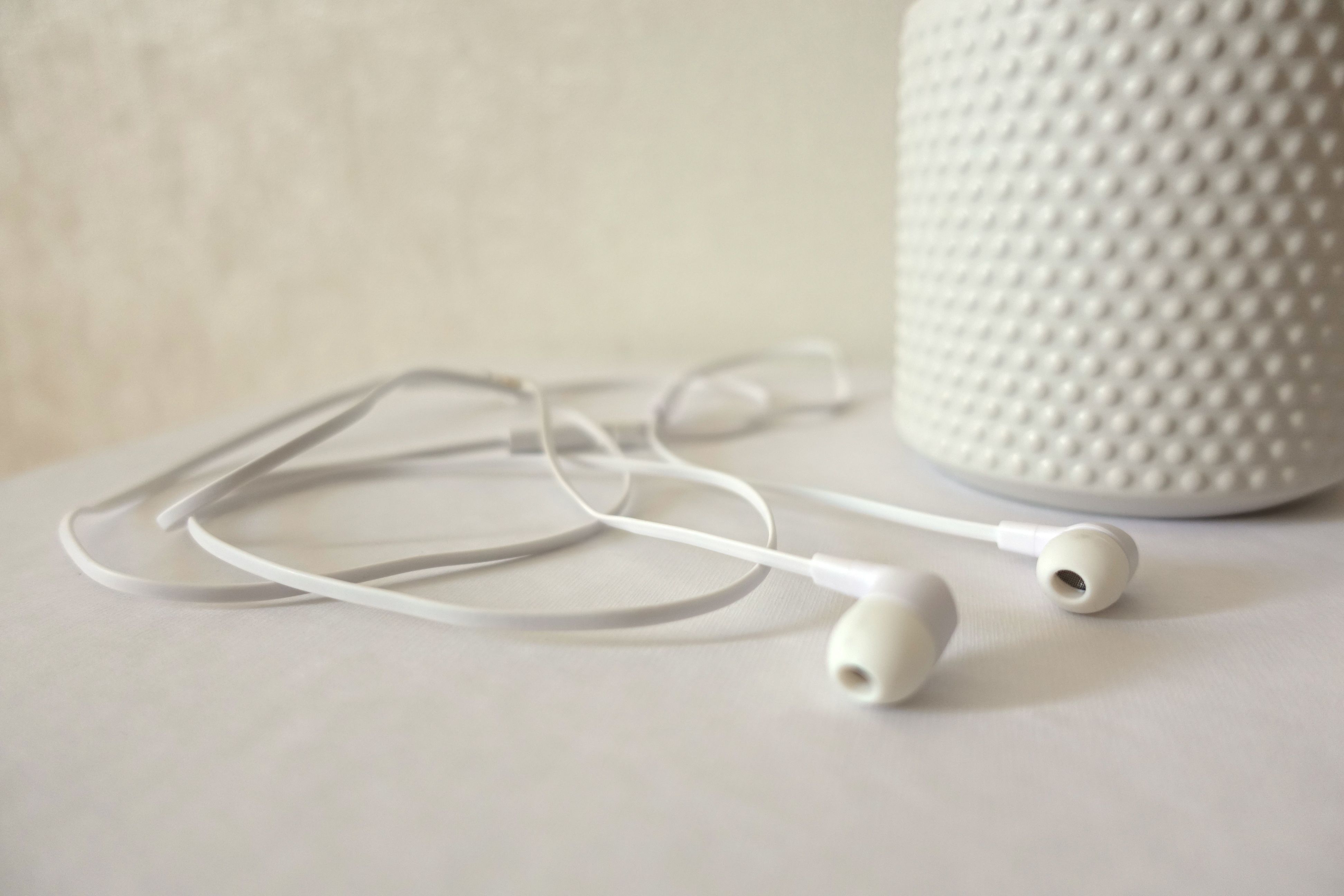 A White Earphones on the Table · Free Stock Photo