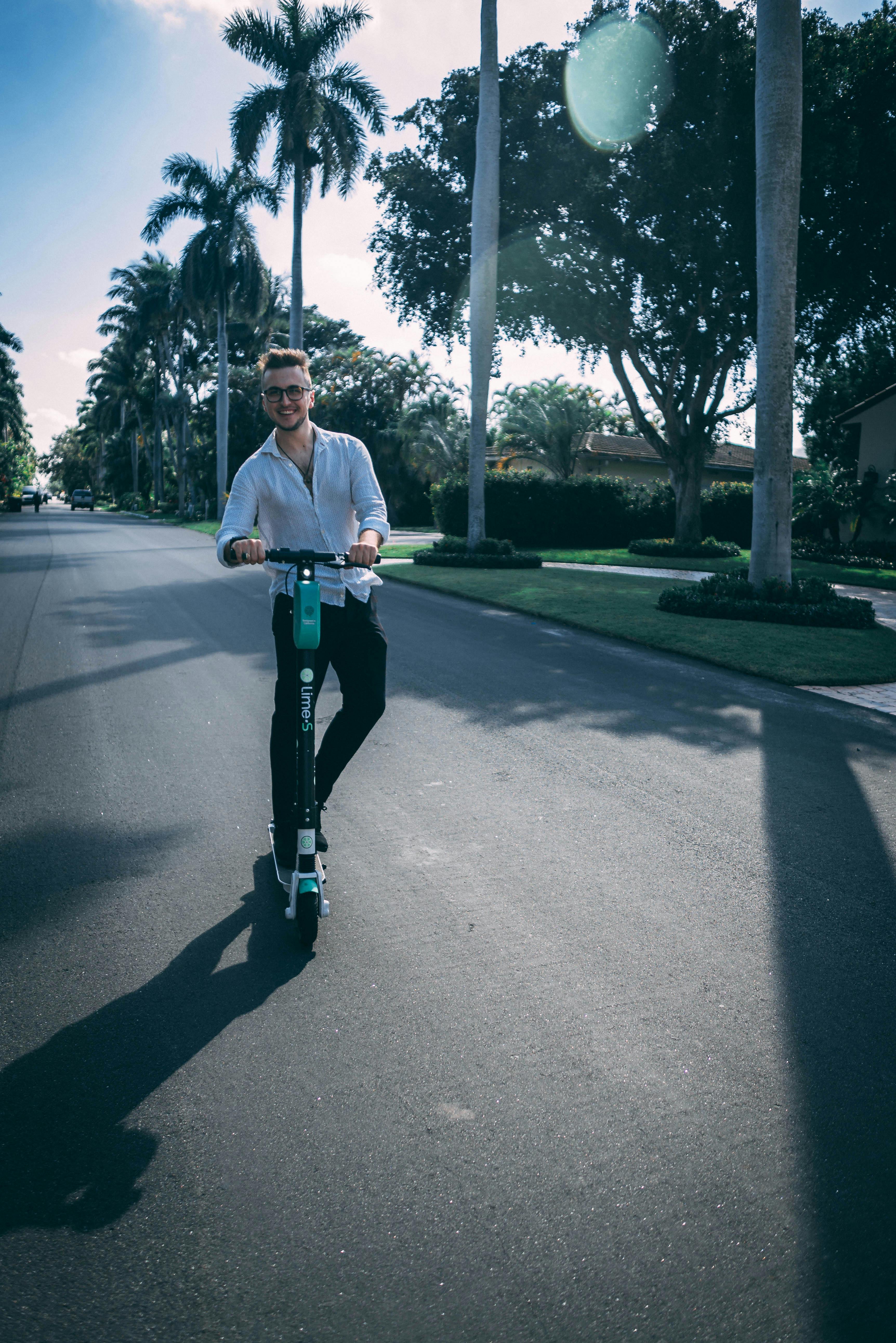 Man Riding on Motor Scooter · Free Stock Photo