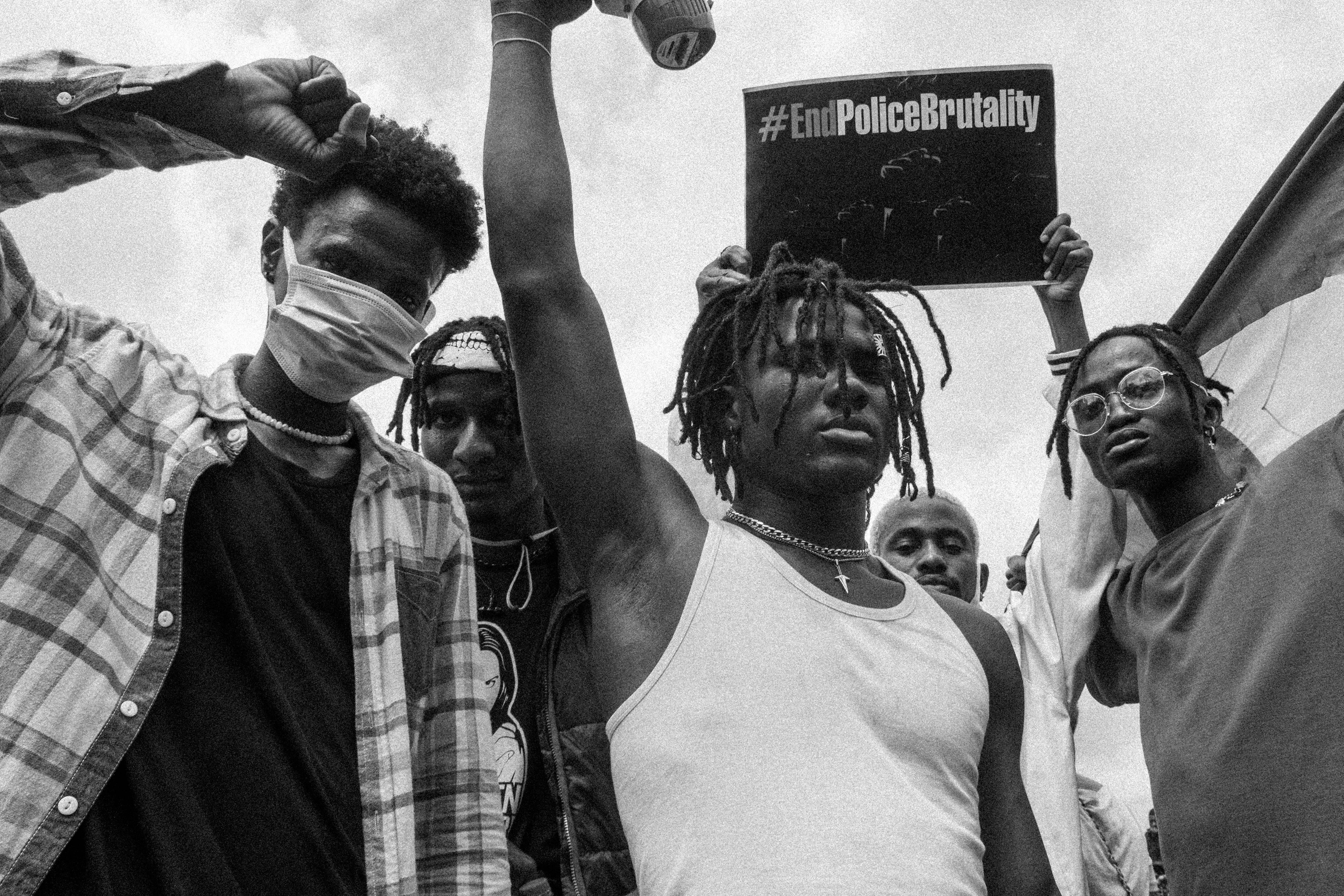 A Grayscale of Men Protesting · Free Stock Photo