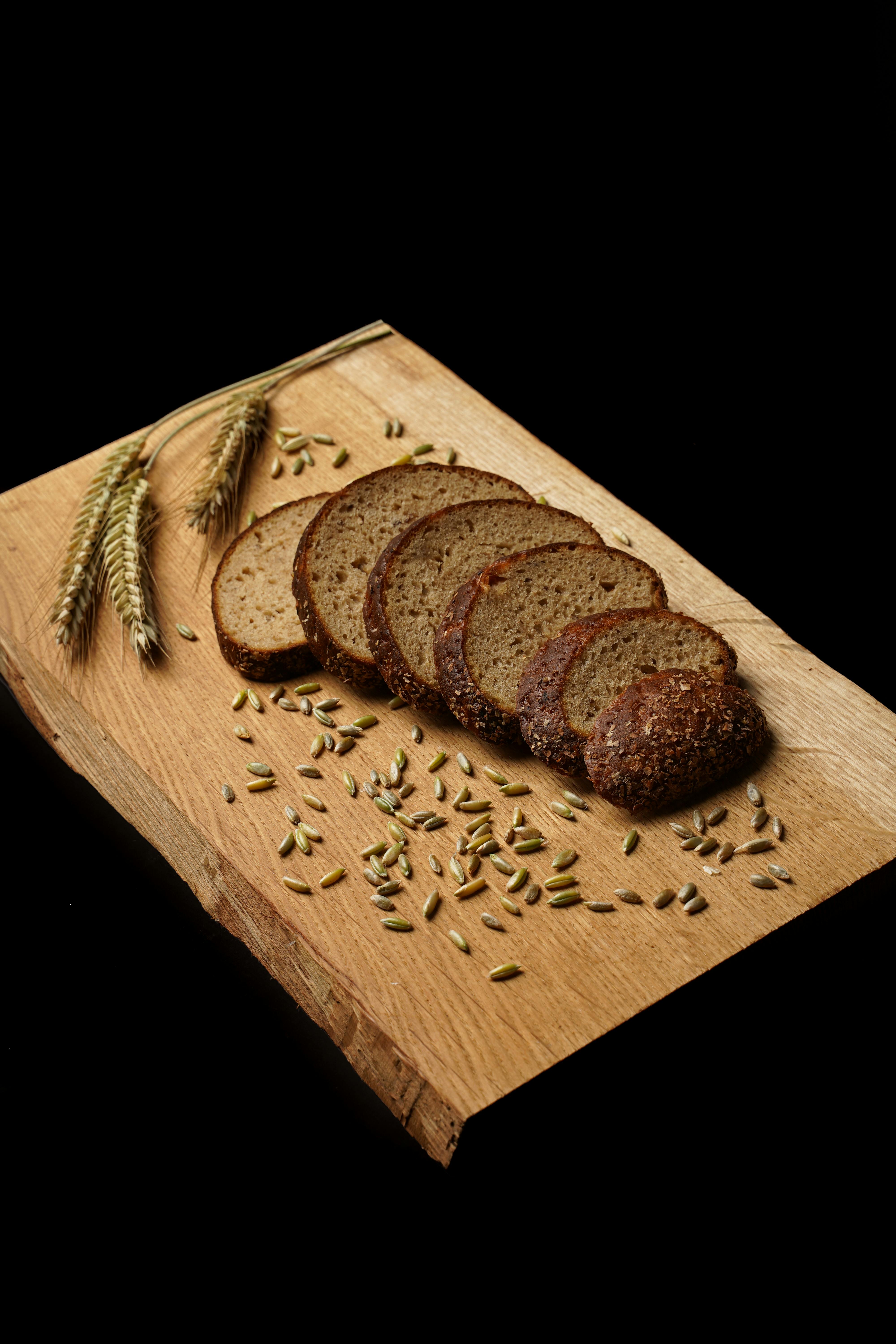 Brown Bread on Brown Wooden Chopping Board · Free Stock Photo