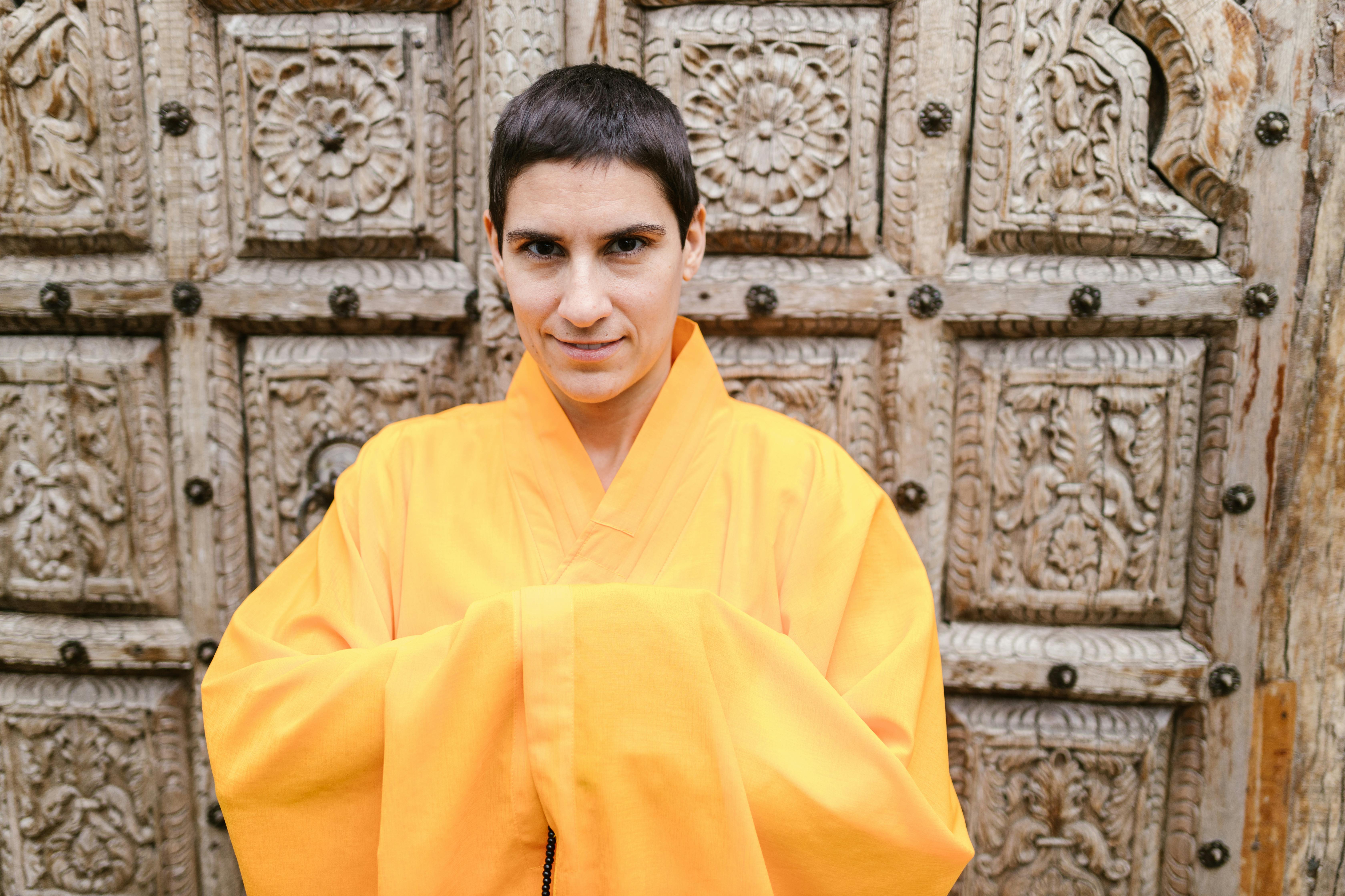 Close-Up Shot of a Person in Yellow Traditional Clothing · Free Stock Photo