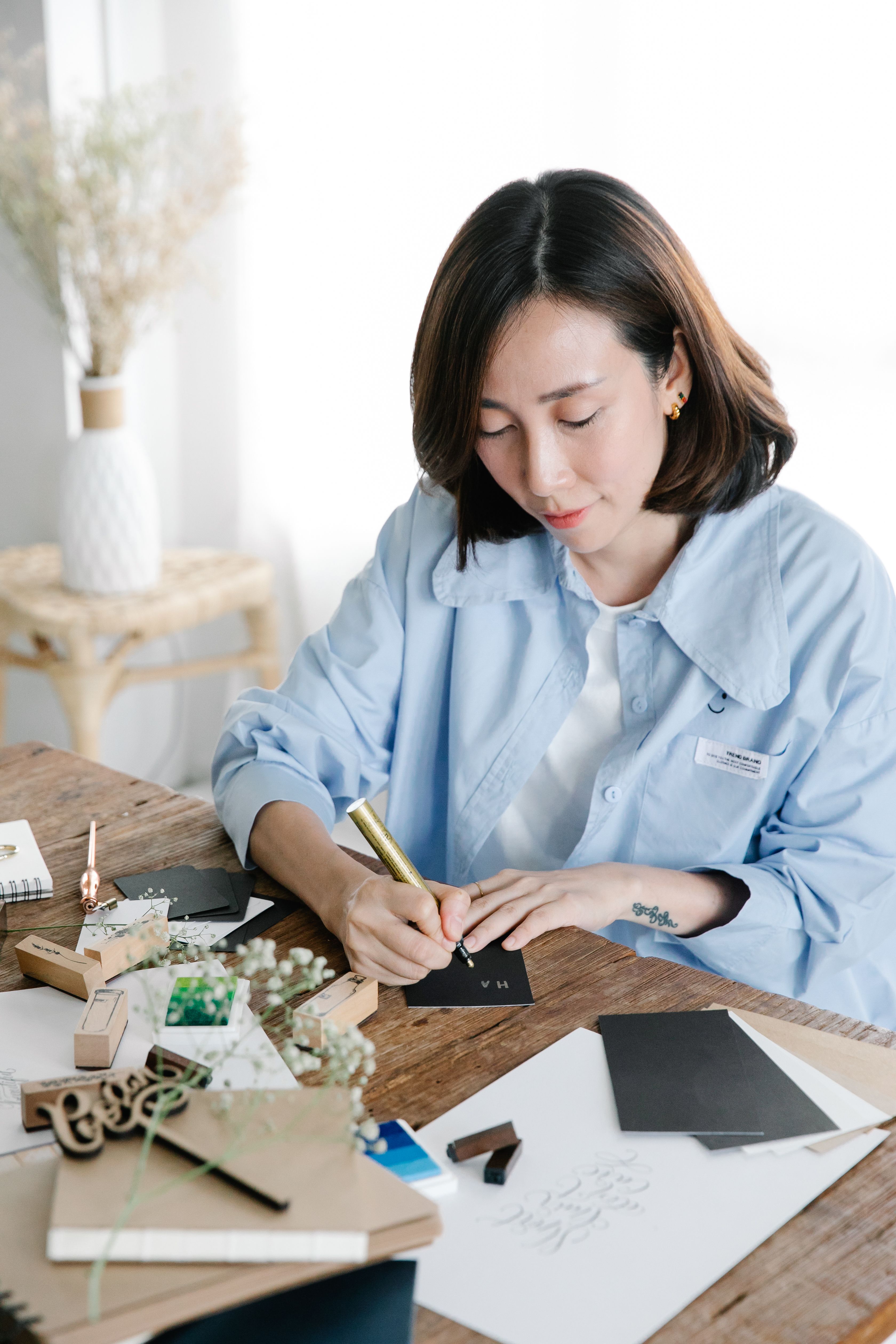 Beautiful Woman Writing on a Cardboard · Free Stock Photo