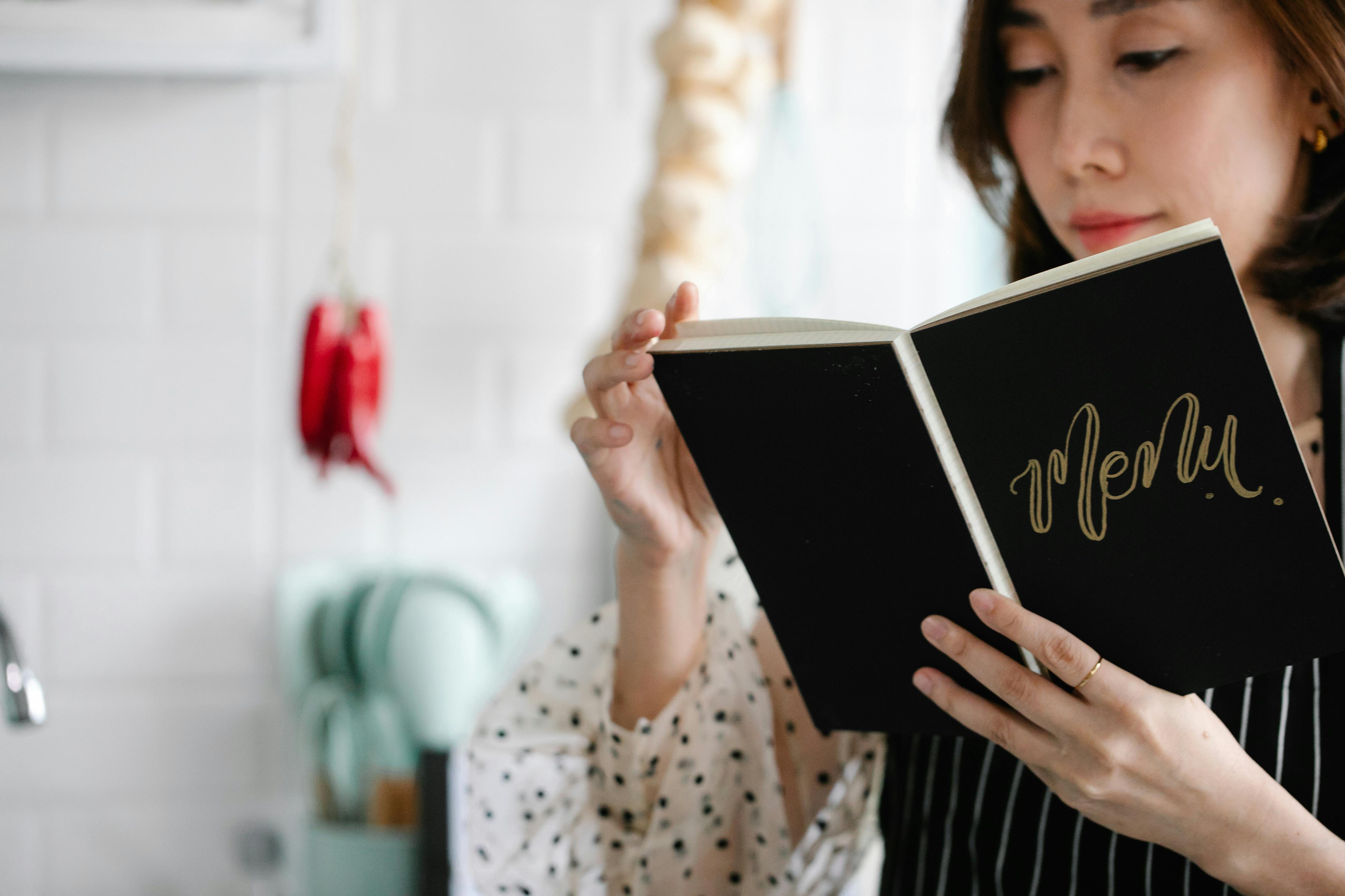 Beautiful Woman Reading a Menu · Free Stock Photo