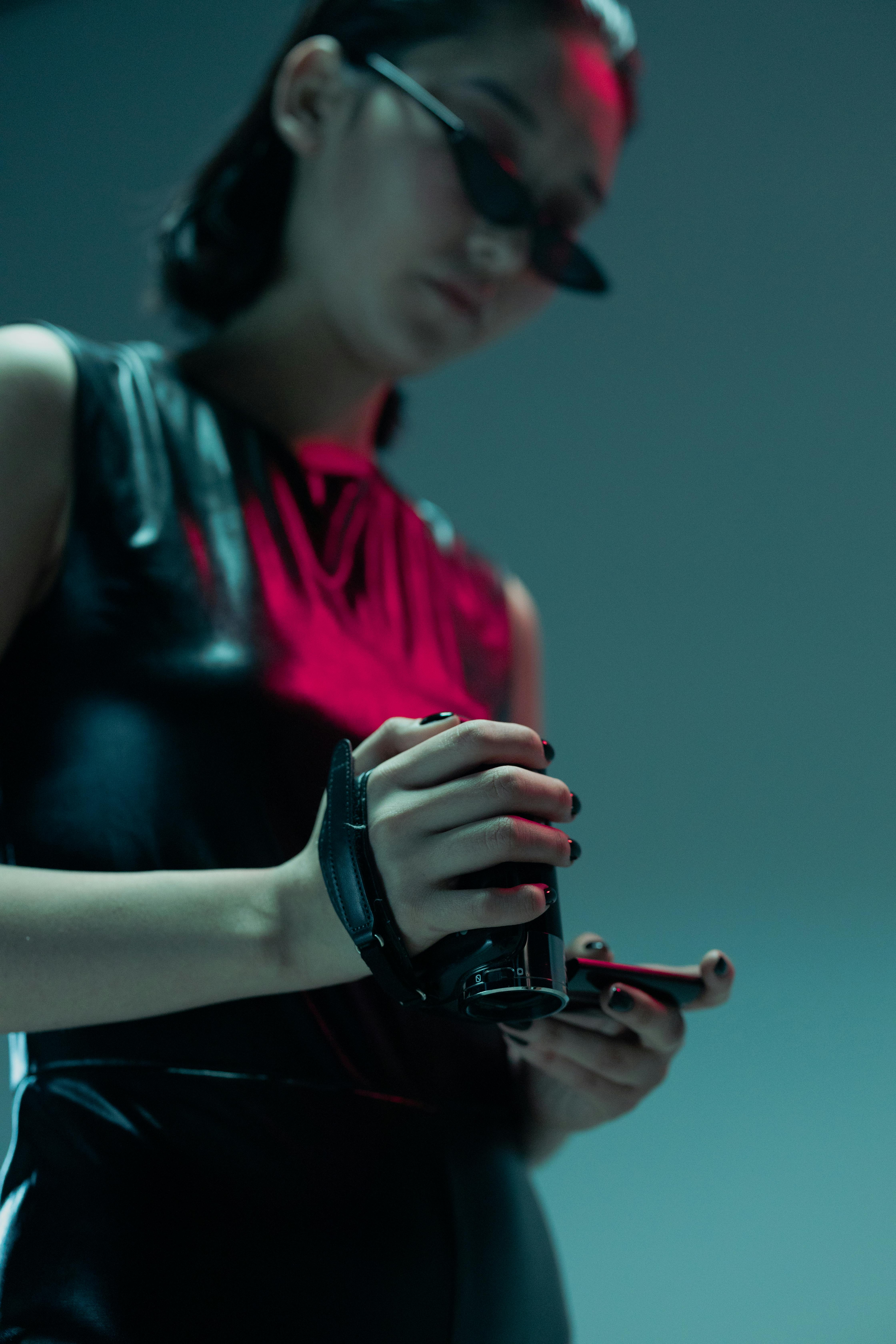 Woman Holding a Black Video Camera · Free Stock Photo