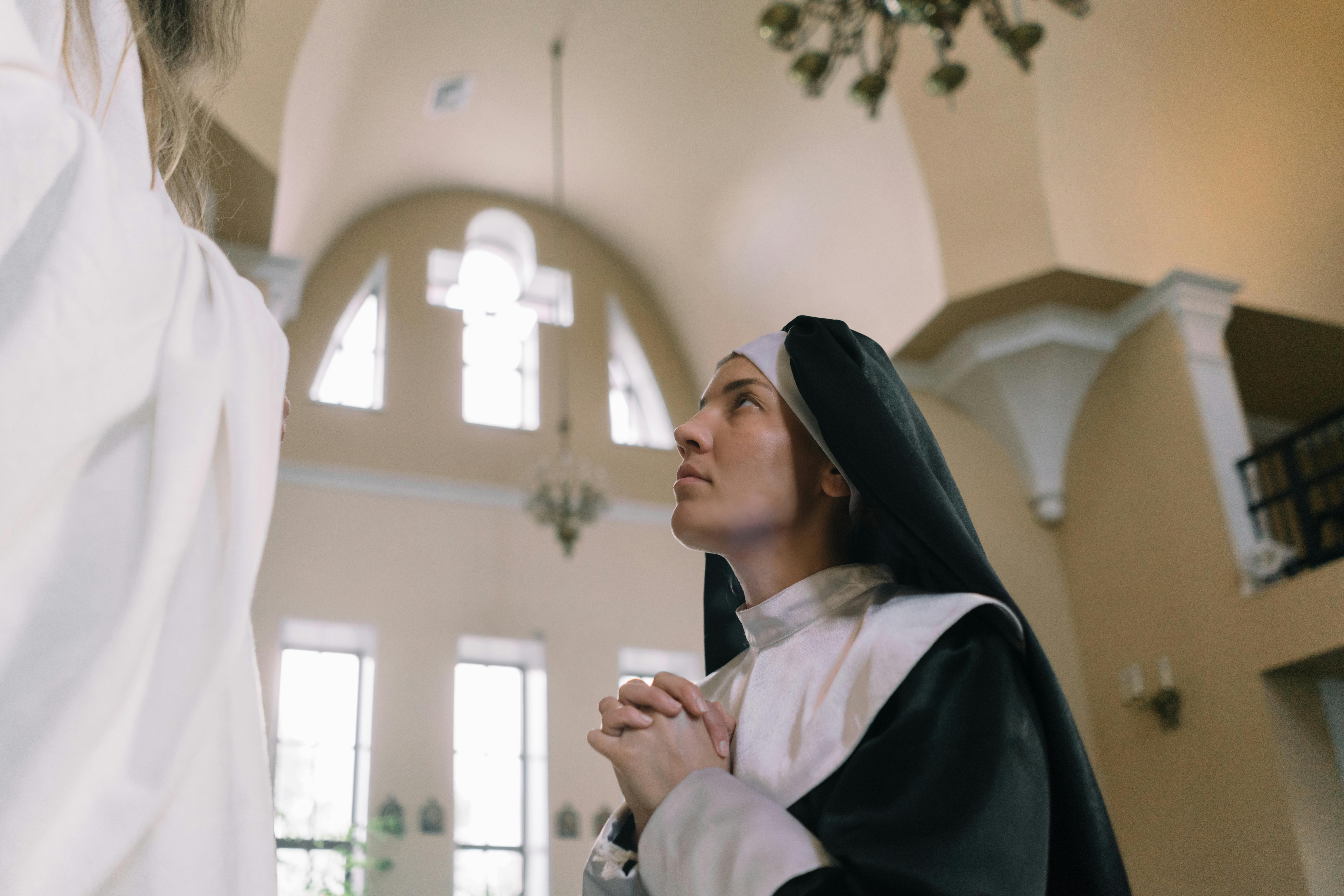 Devout Nun in Deep Thoughts · Free Stock Photo