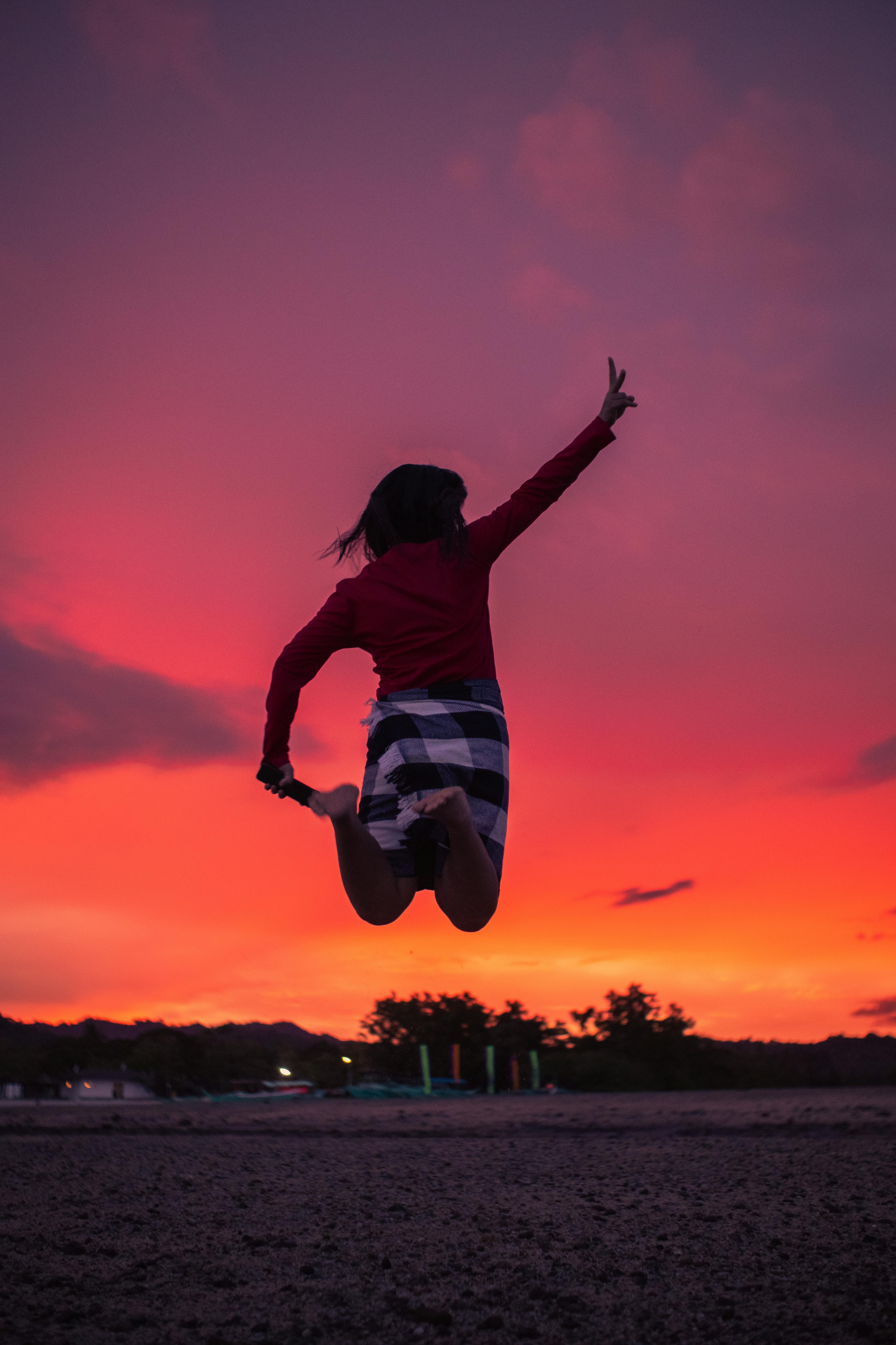 Woman Posing While Jumping · Free Stock Photo