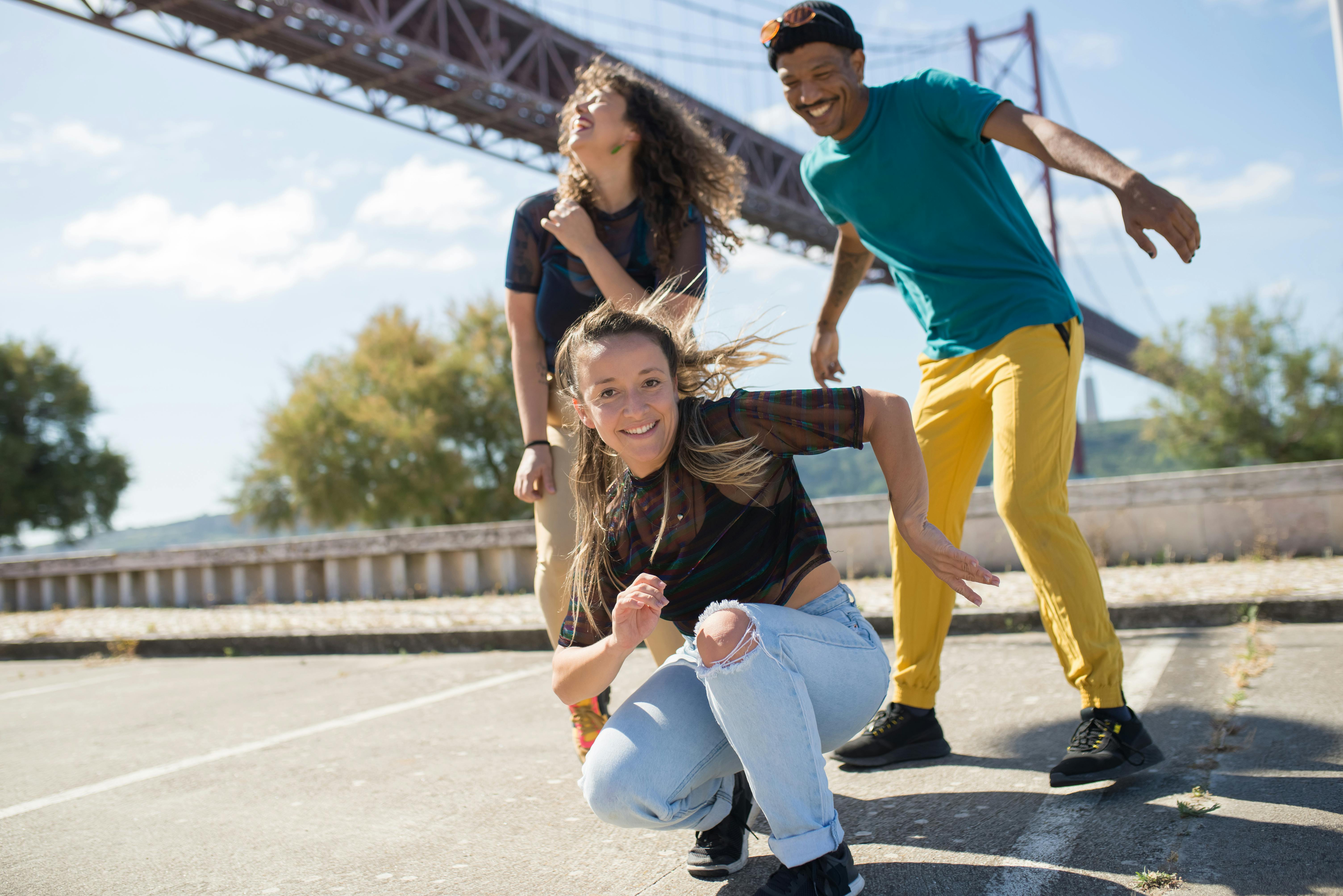 Friends Dancing Together on the Street · Free Stock Photo