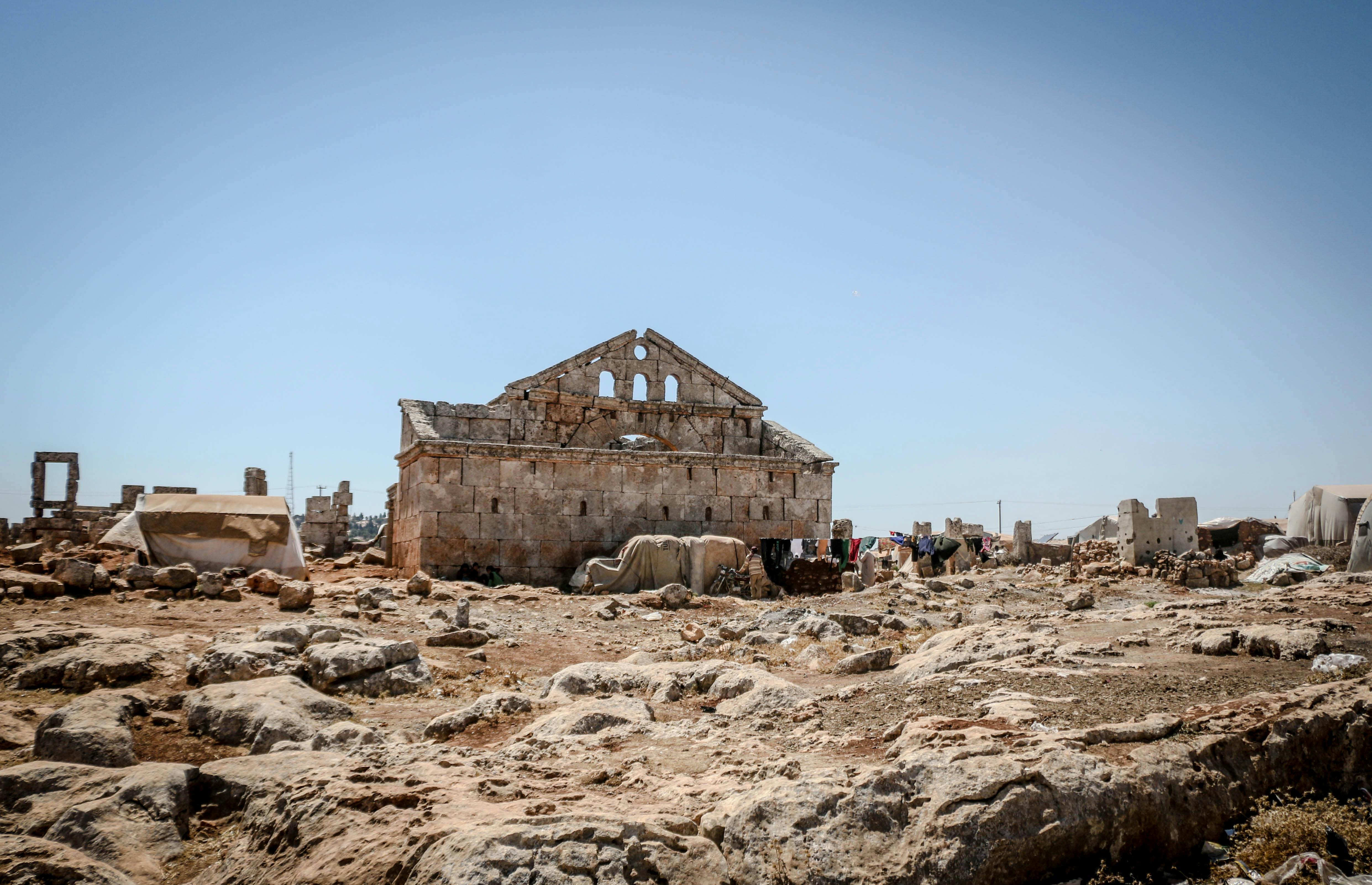 Two White Concrete Statues Covered by Dust · Free Stock Photo