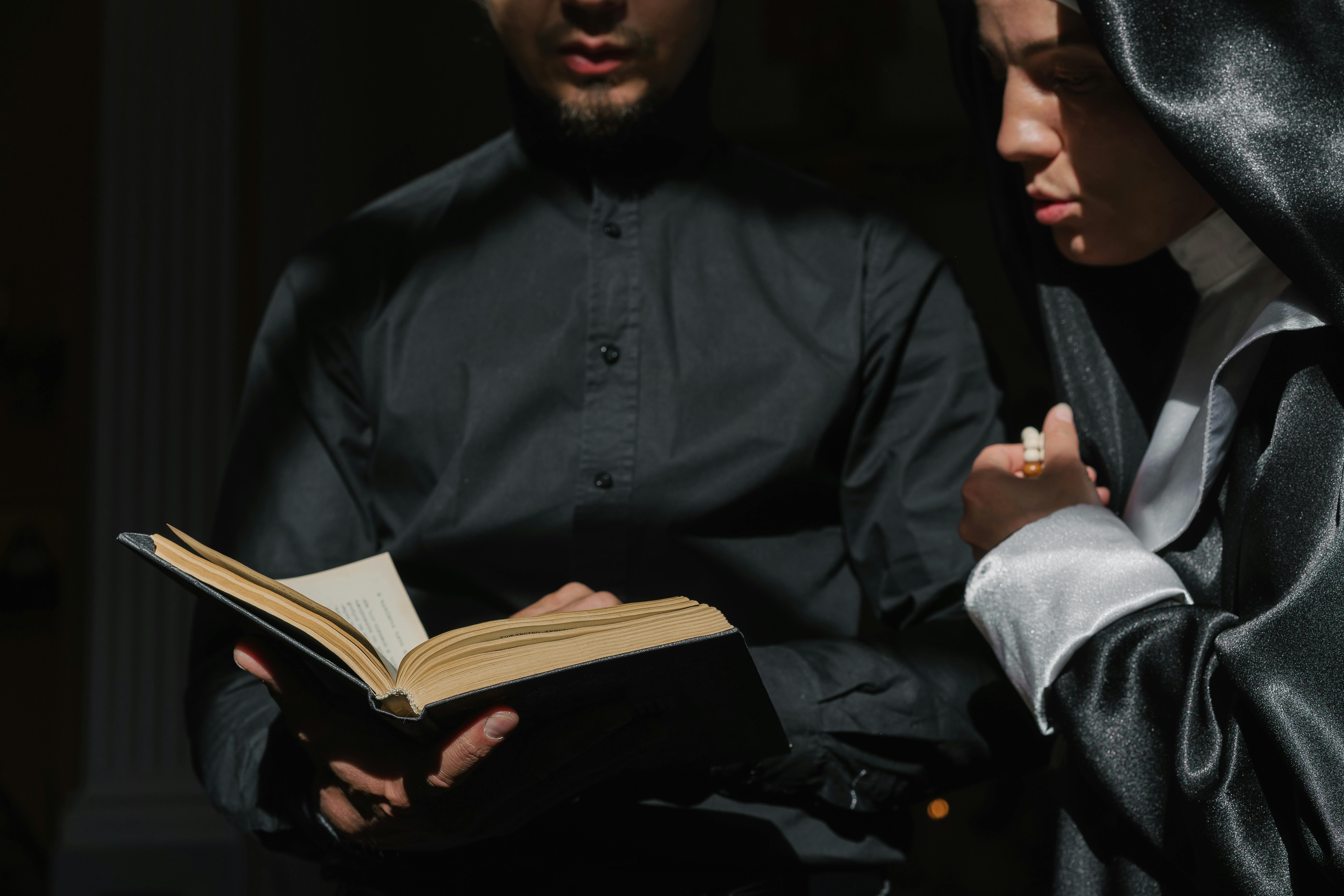 Religious People Reading a Book · Free Stock Photo
