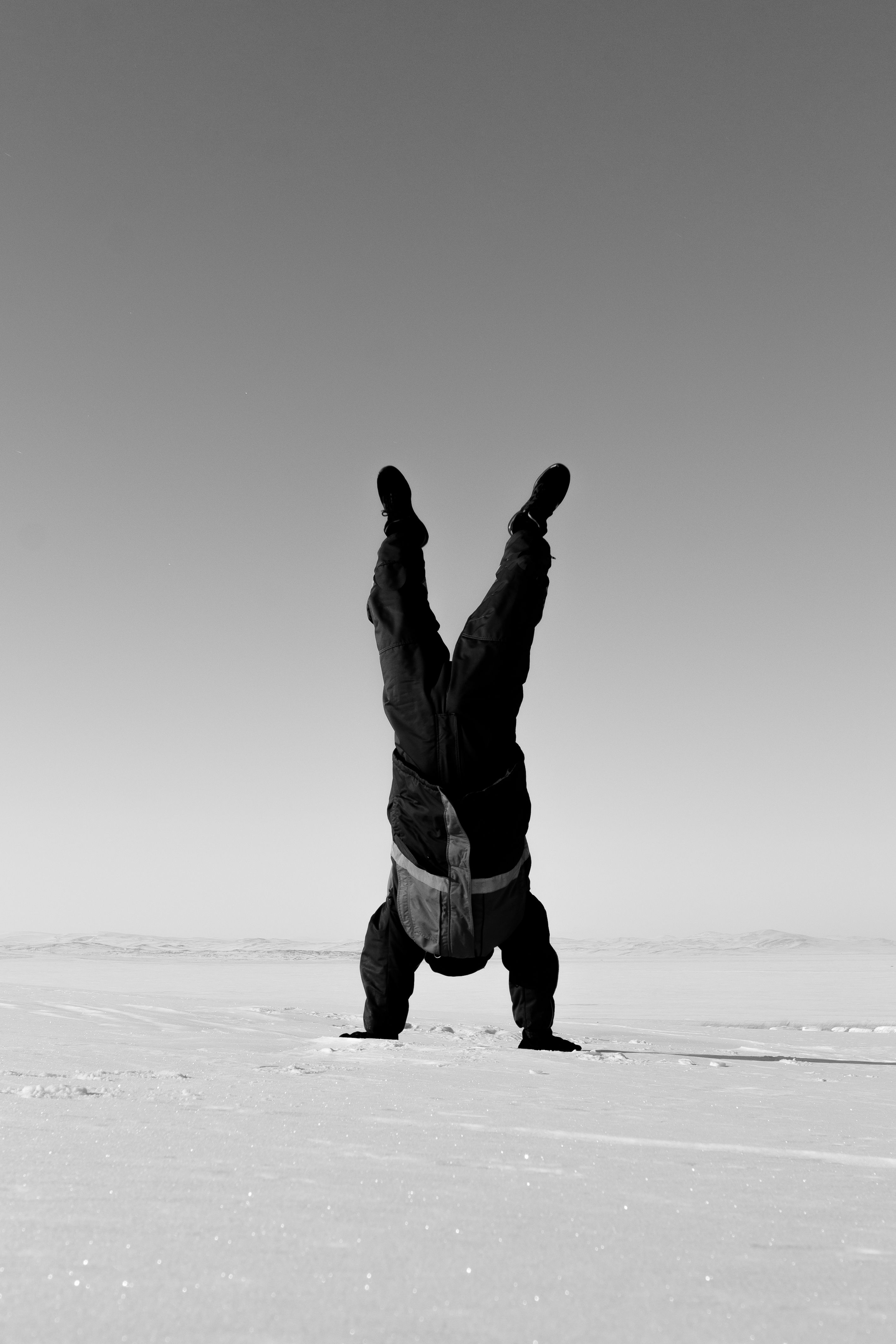 Man Doing a Handstand in the Snow · Free Stock Photo