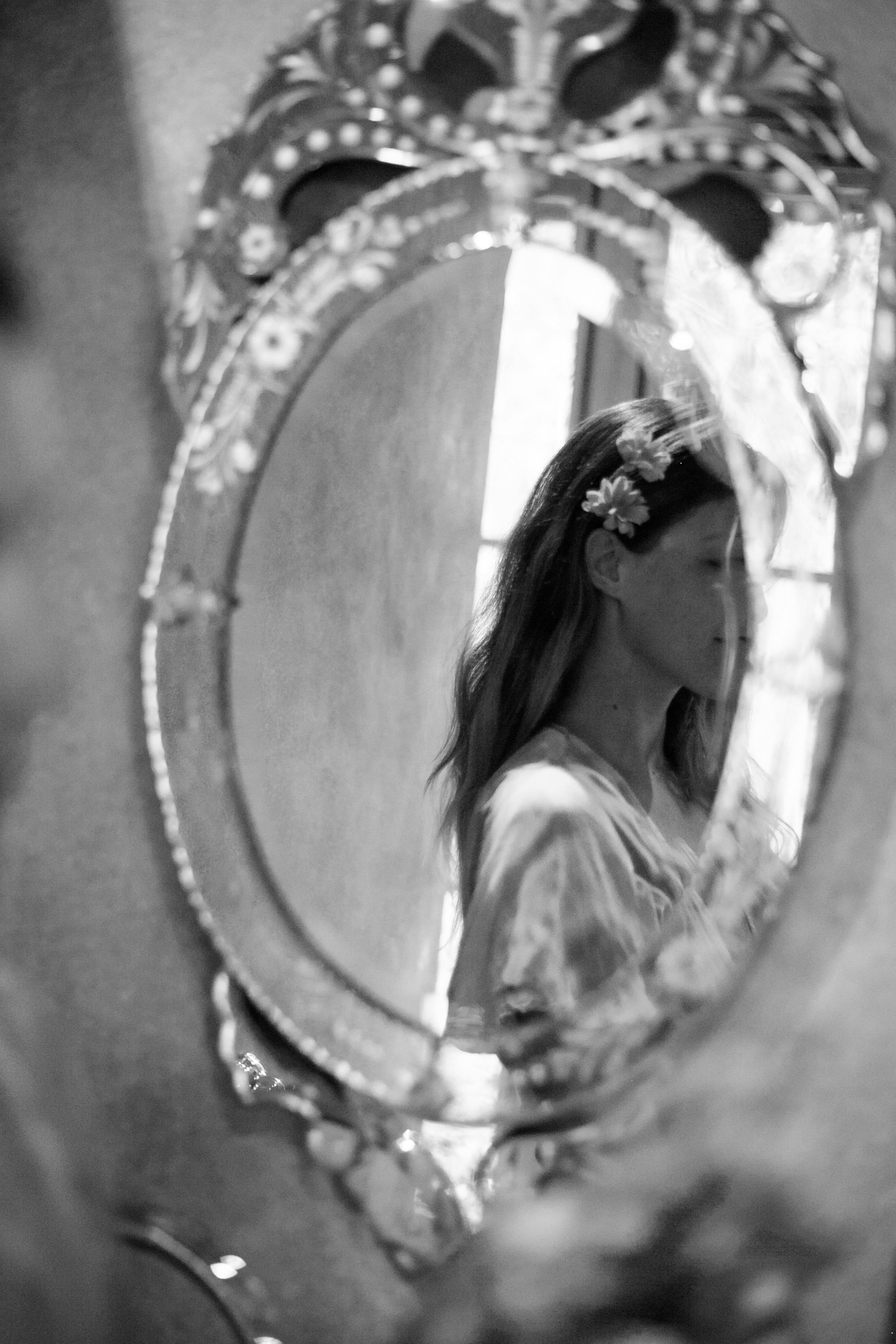 Girl Looking at her Reflection in a Broken Mirror · Free Stock Photo