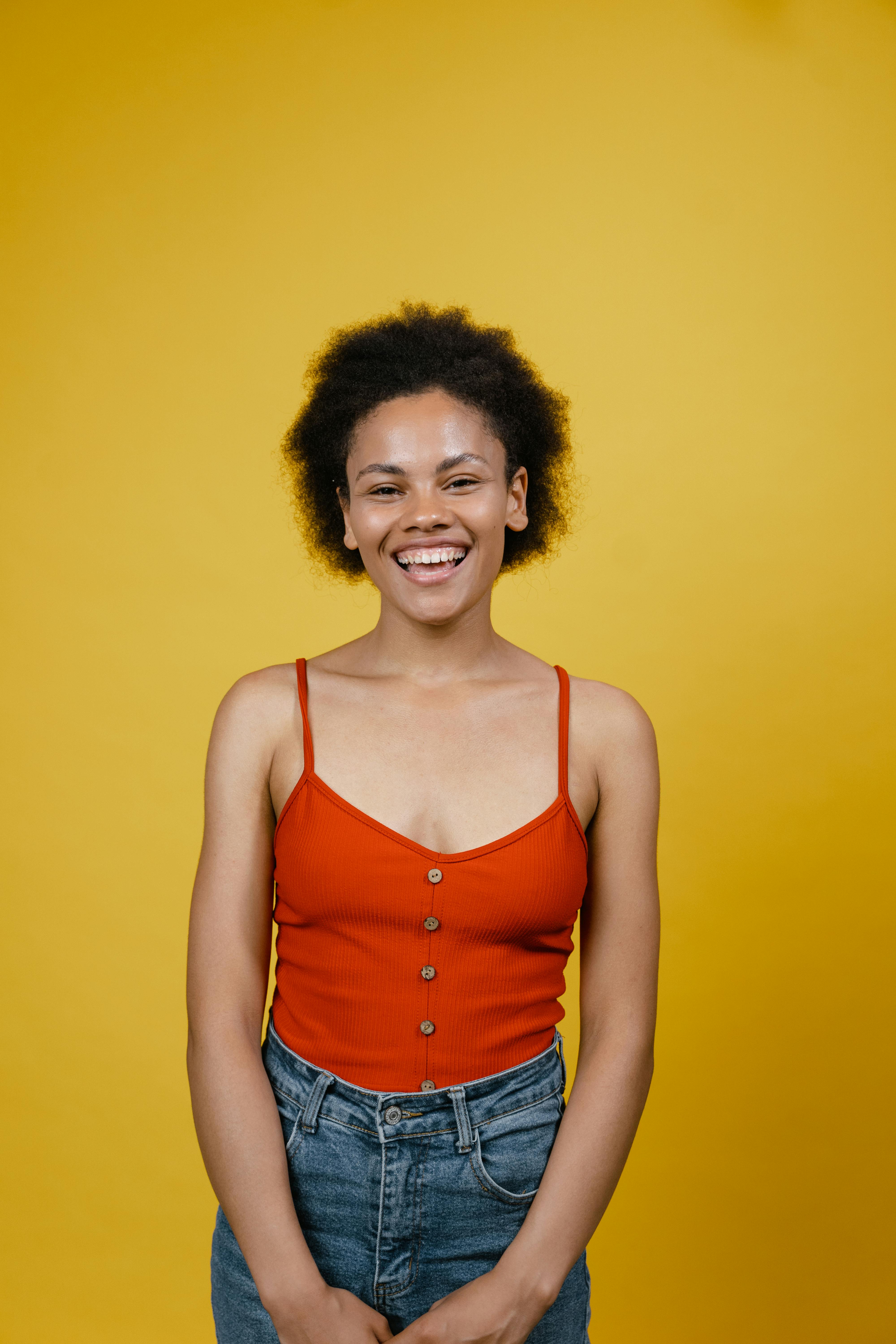 Woman in Red Tank Top Smiling at the camera · Free Stock Photo