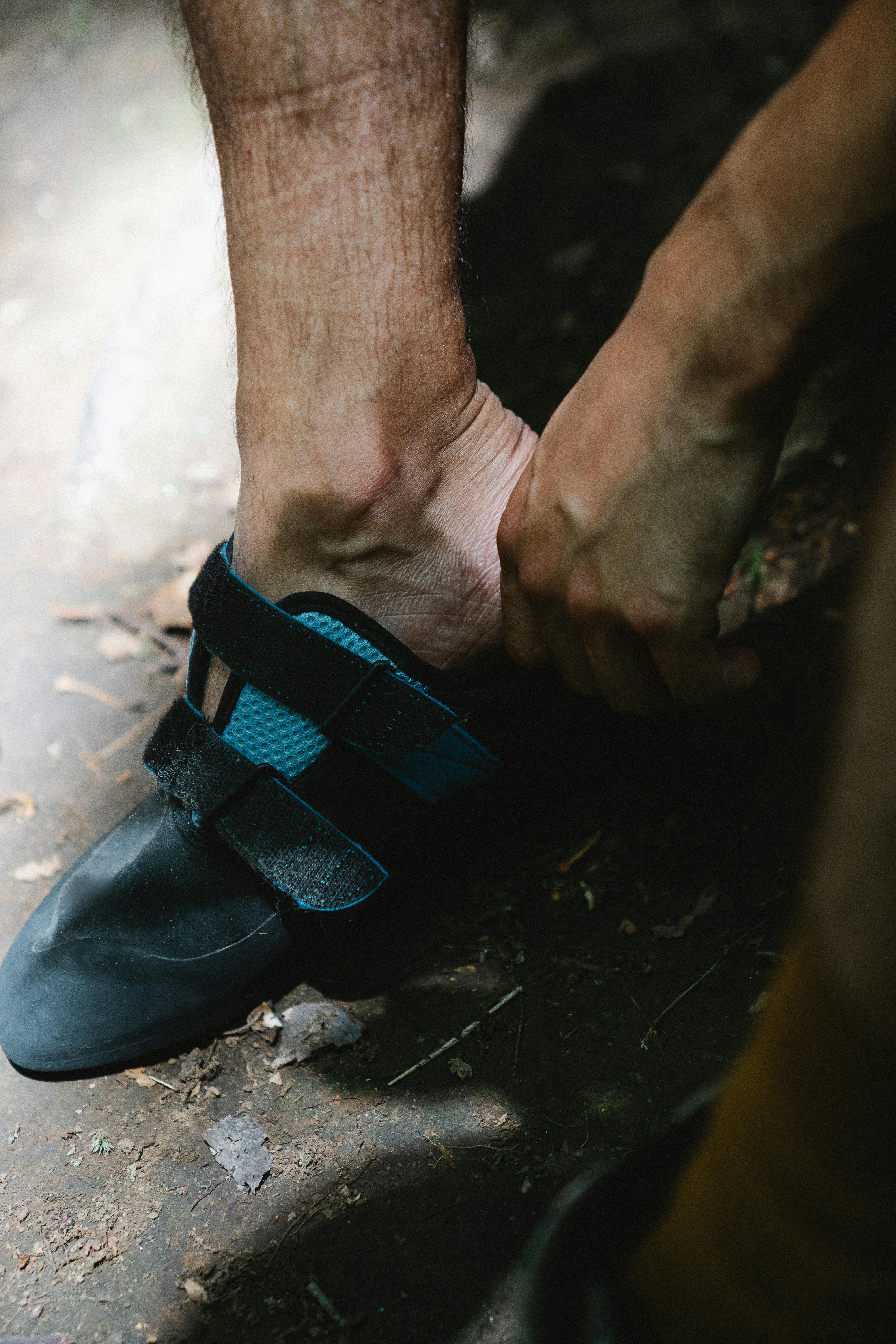 Close-Up Shot of a person Tying Shoes · Free Stock Photo
