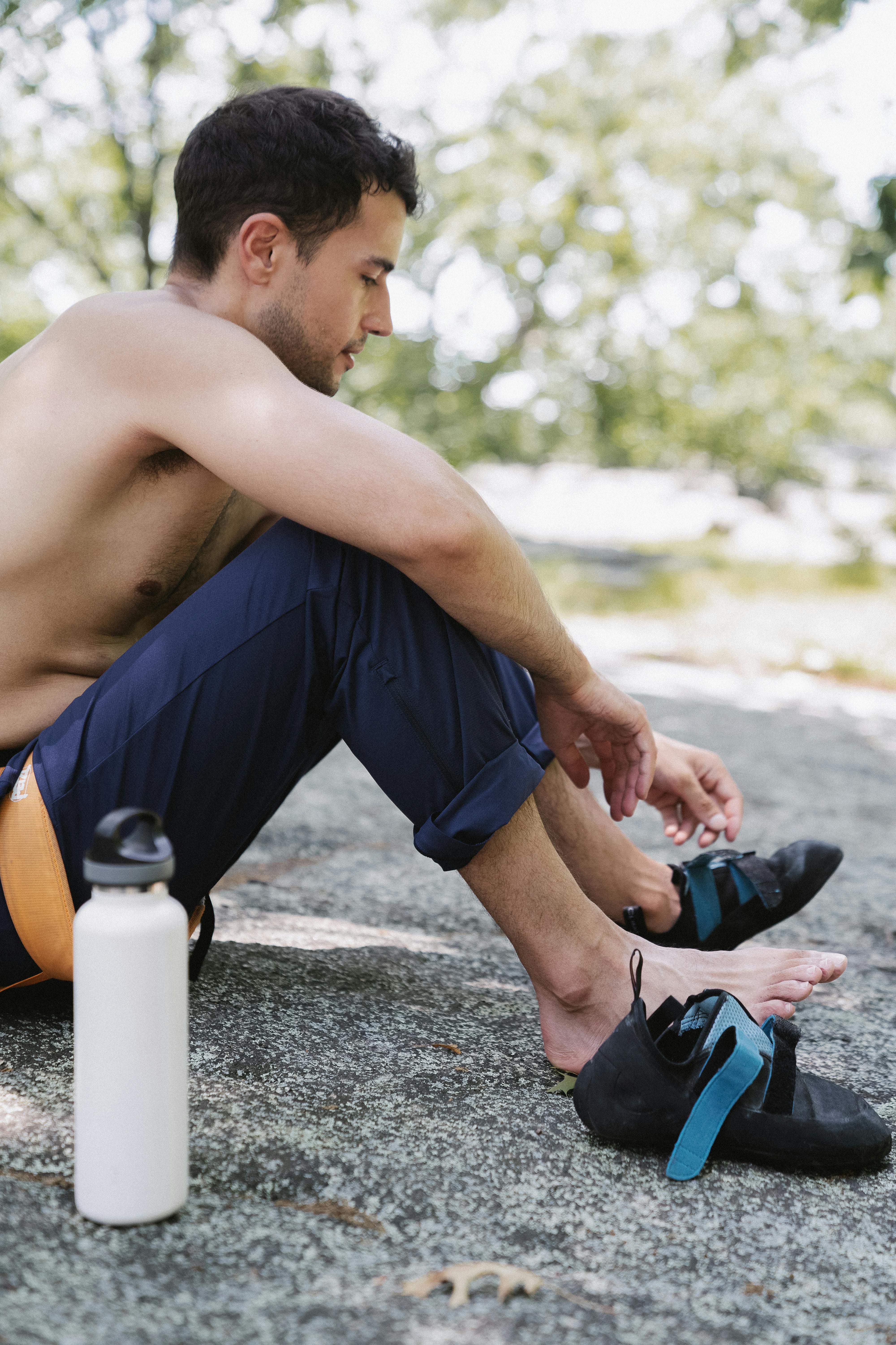 Man Removing his Climbing Shoes · Free Stock Photo