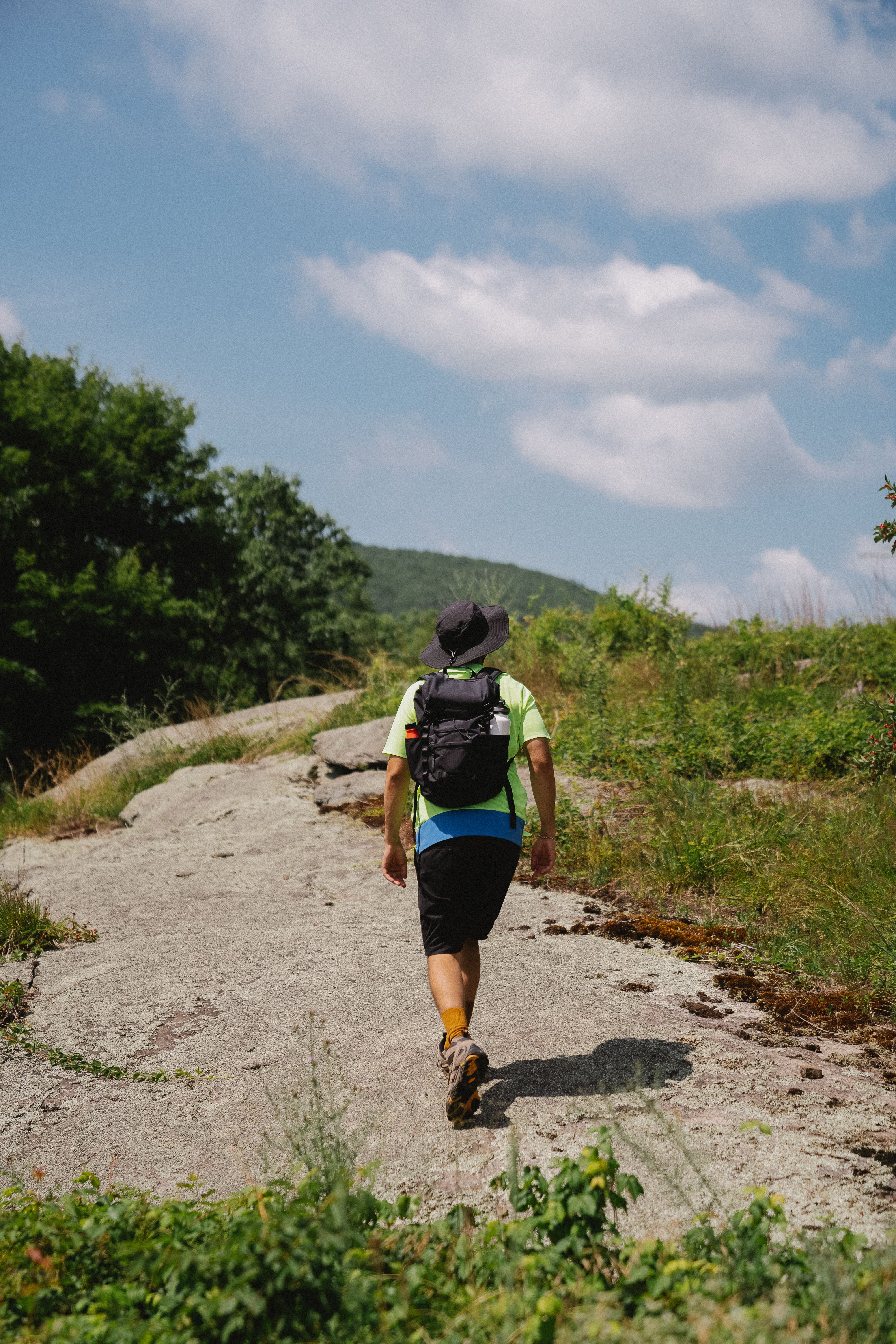 A Man with a Backpack Walking · Free Stock Photo