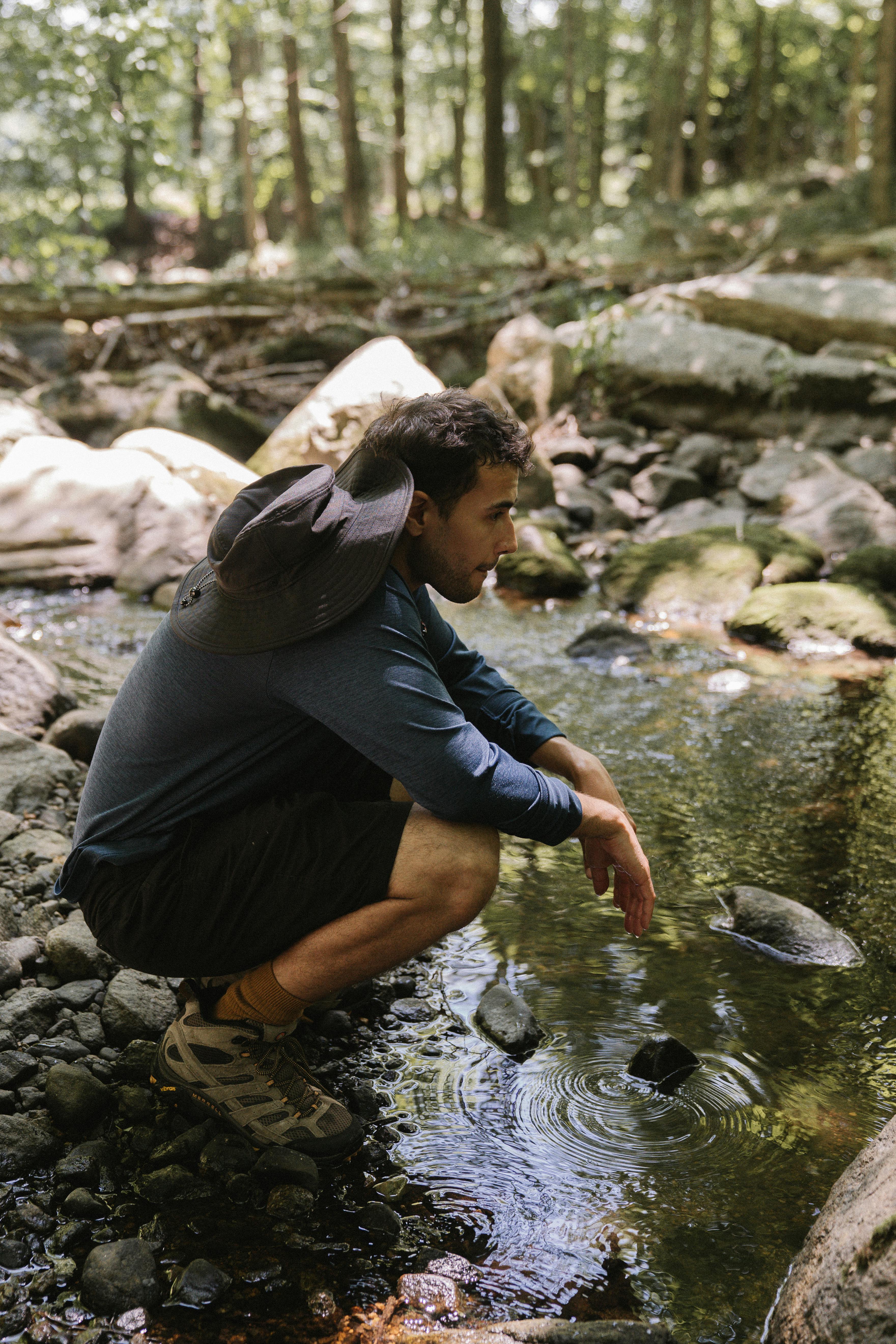 A Man Hiking in the Forest · Free Stock Photo