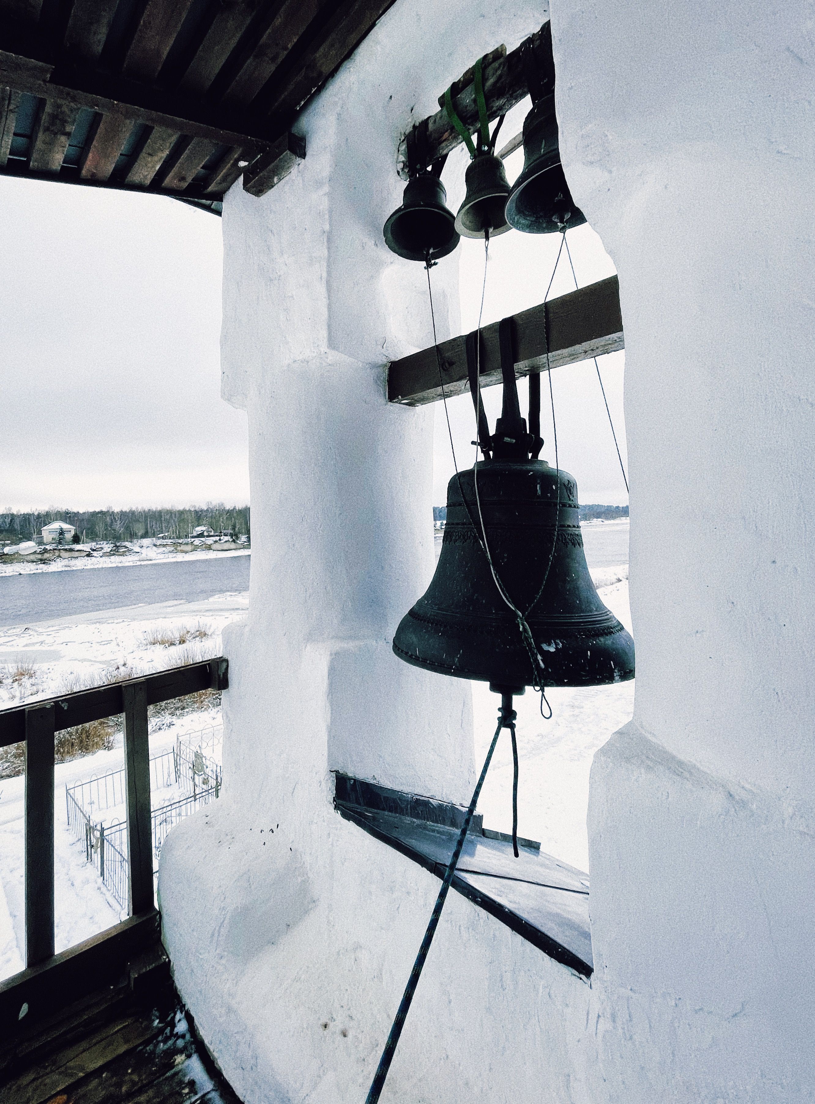 A Brown Concrete Bell Tower Under White Clouds · Free Stock Photo