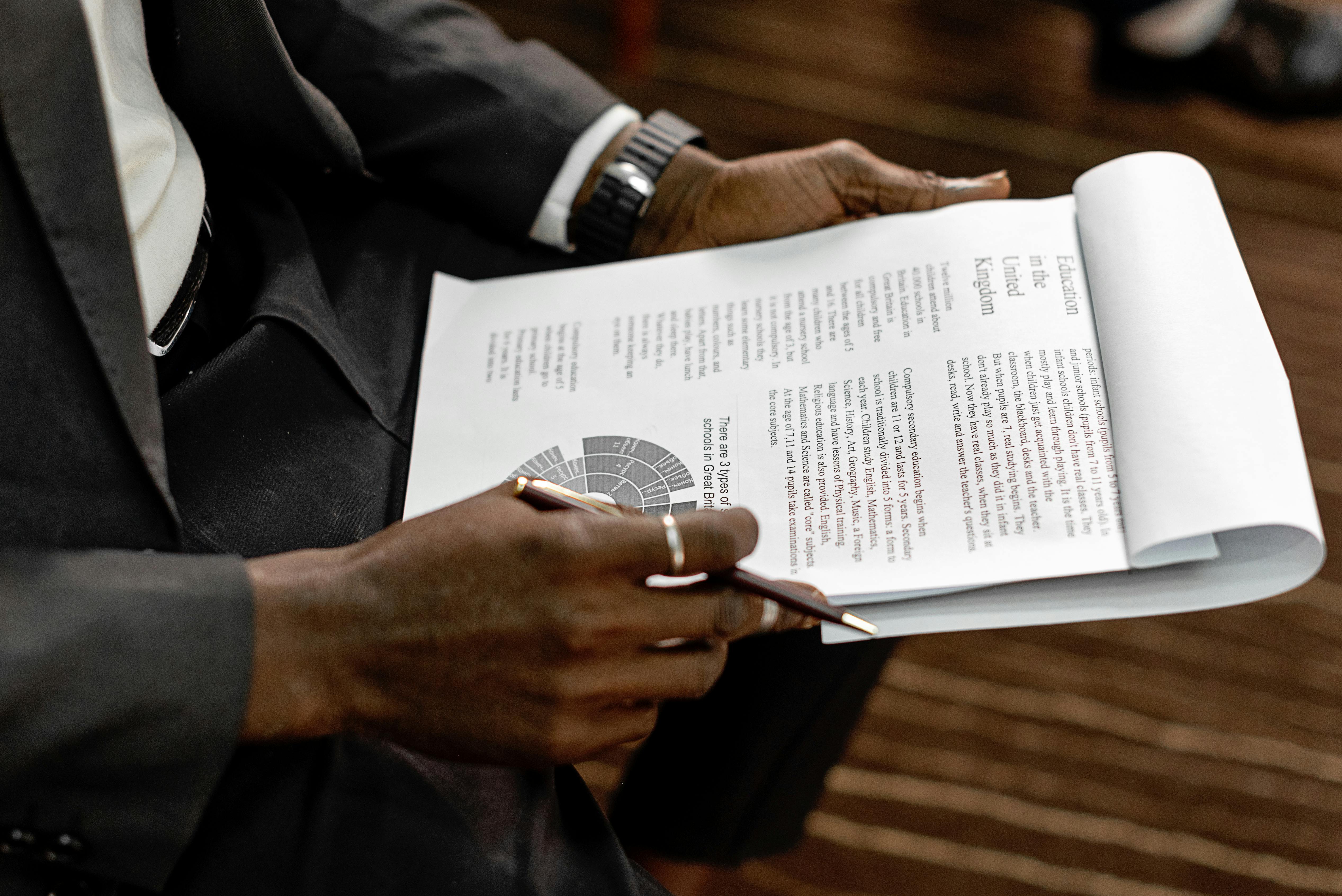 A Person Signing a Contract · Free Stock Photo