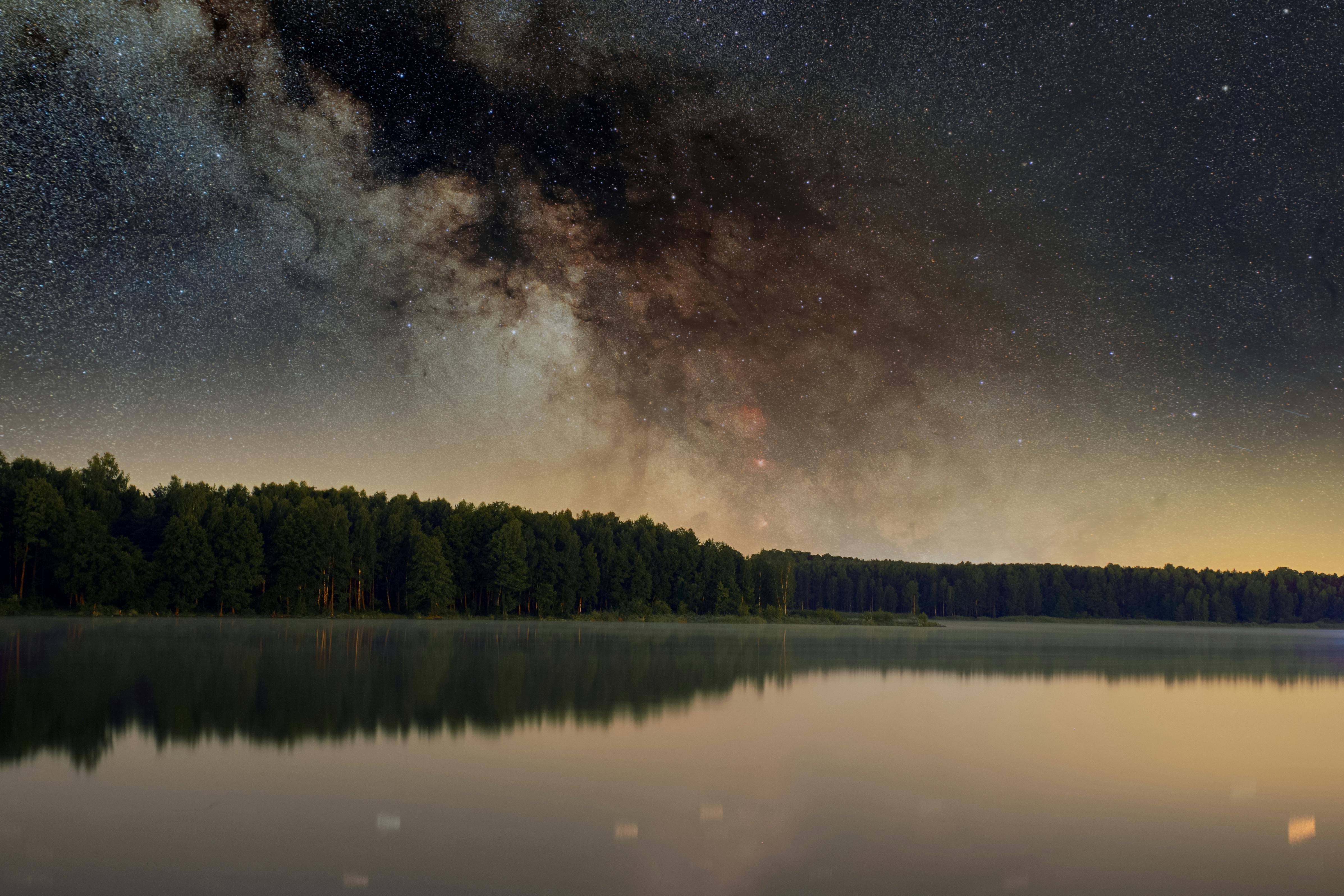 A Starry Night Sky over a Lake · Free Stock Photo