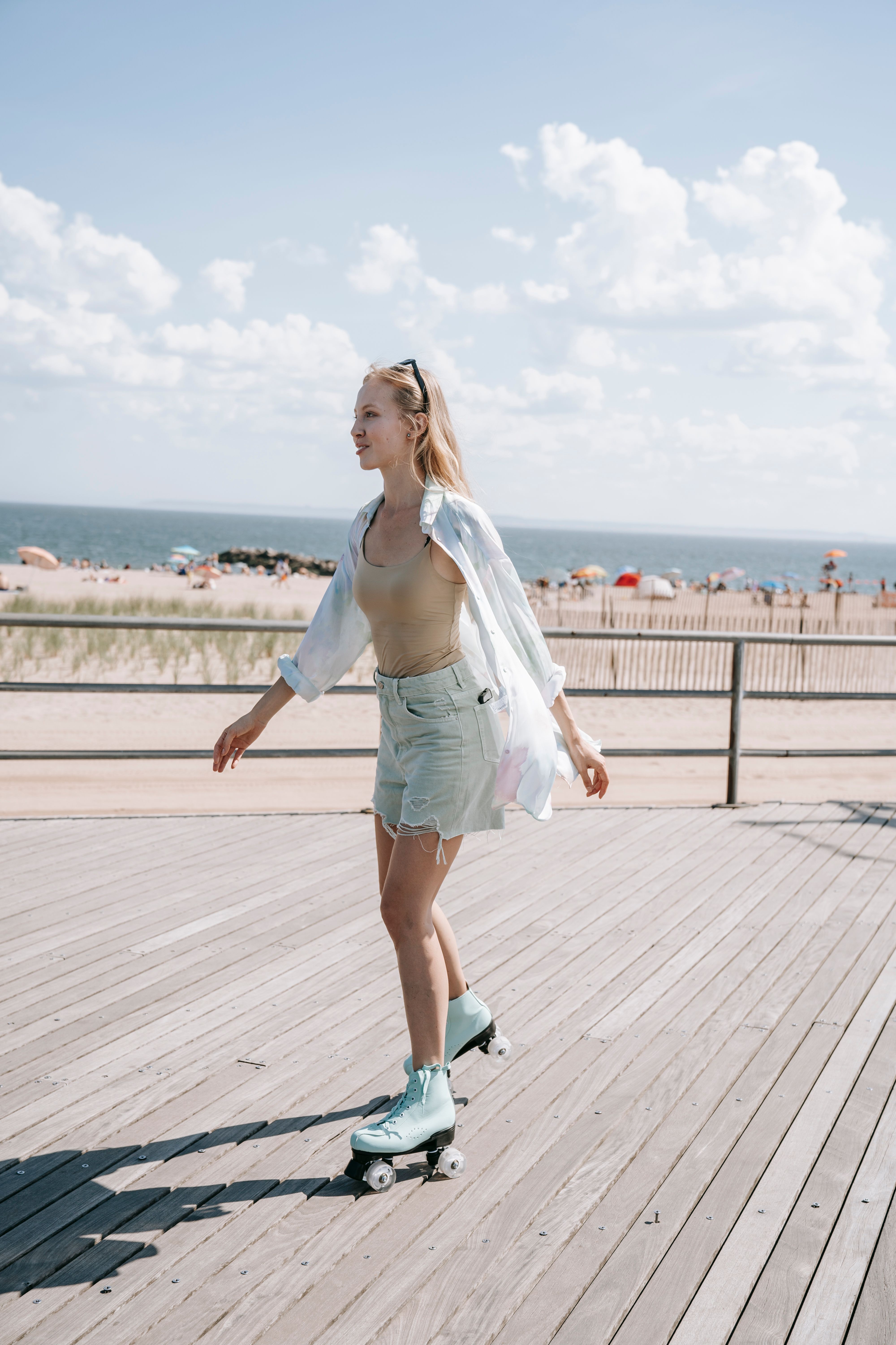 Woman Skating on Rollers on Beach · Free Stock Photo