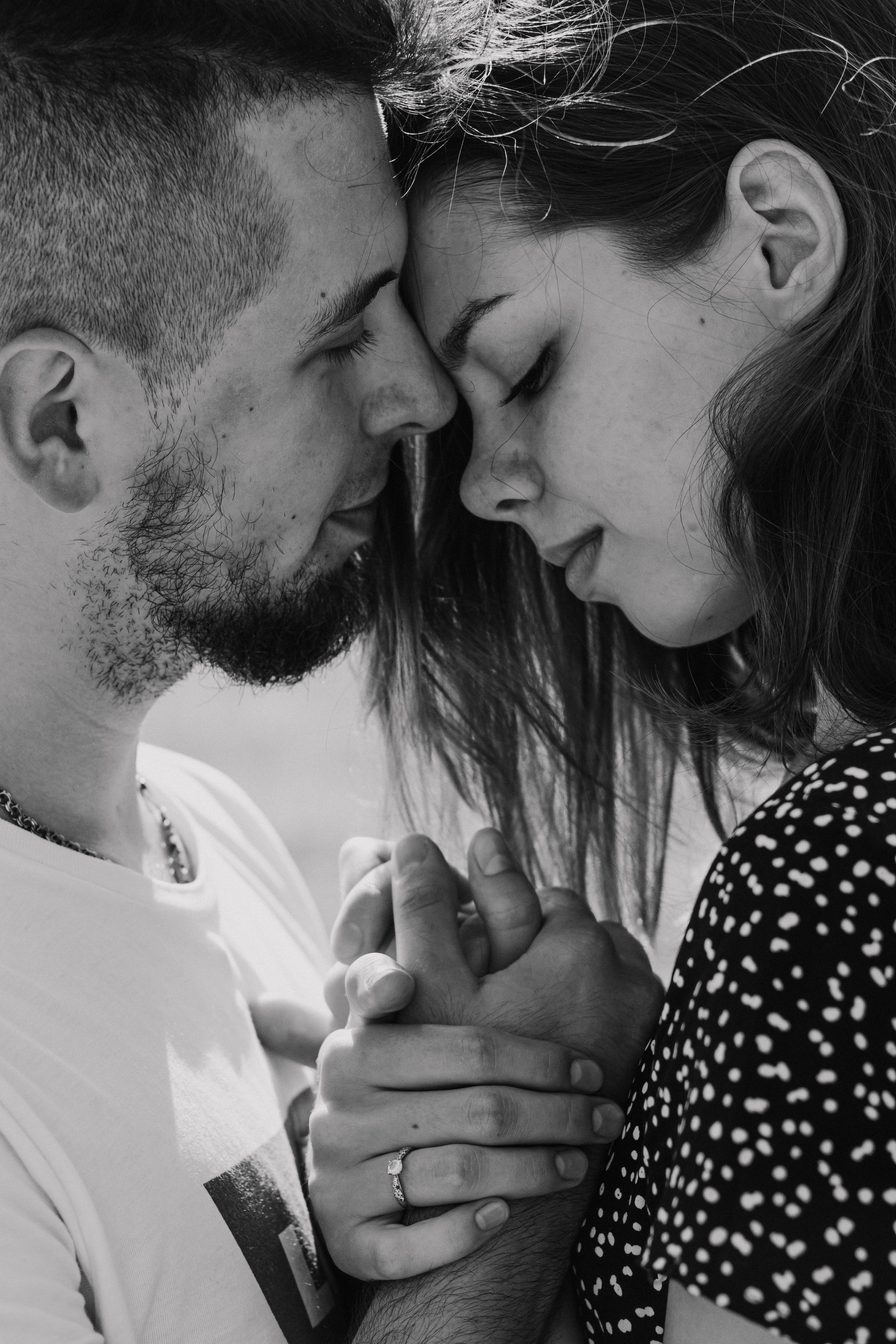 An Intimate Couple Holding Hands · Free Stock Photo