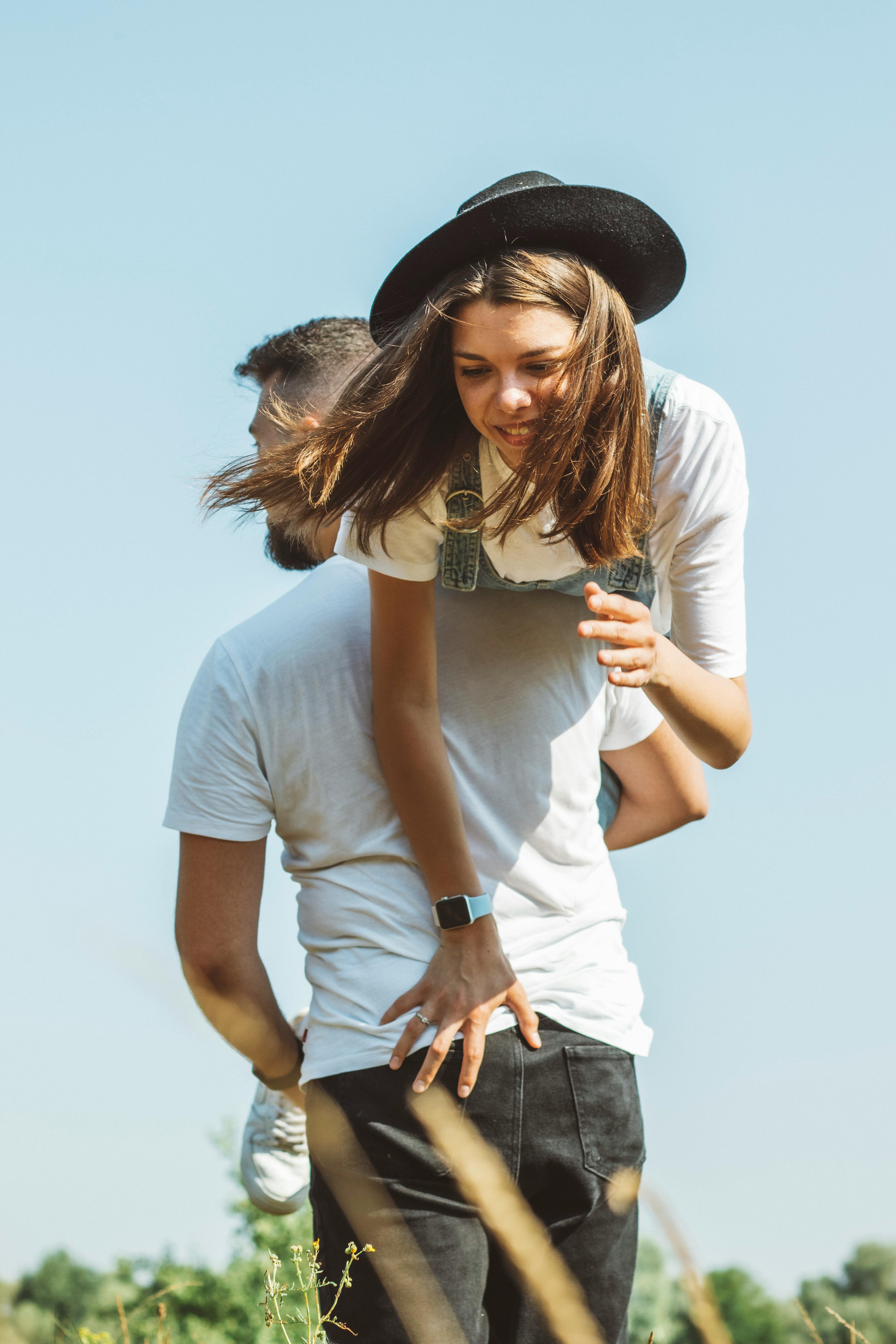 Guy Carrying Girlfriend Over Shoulder
