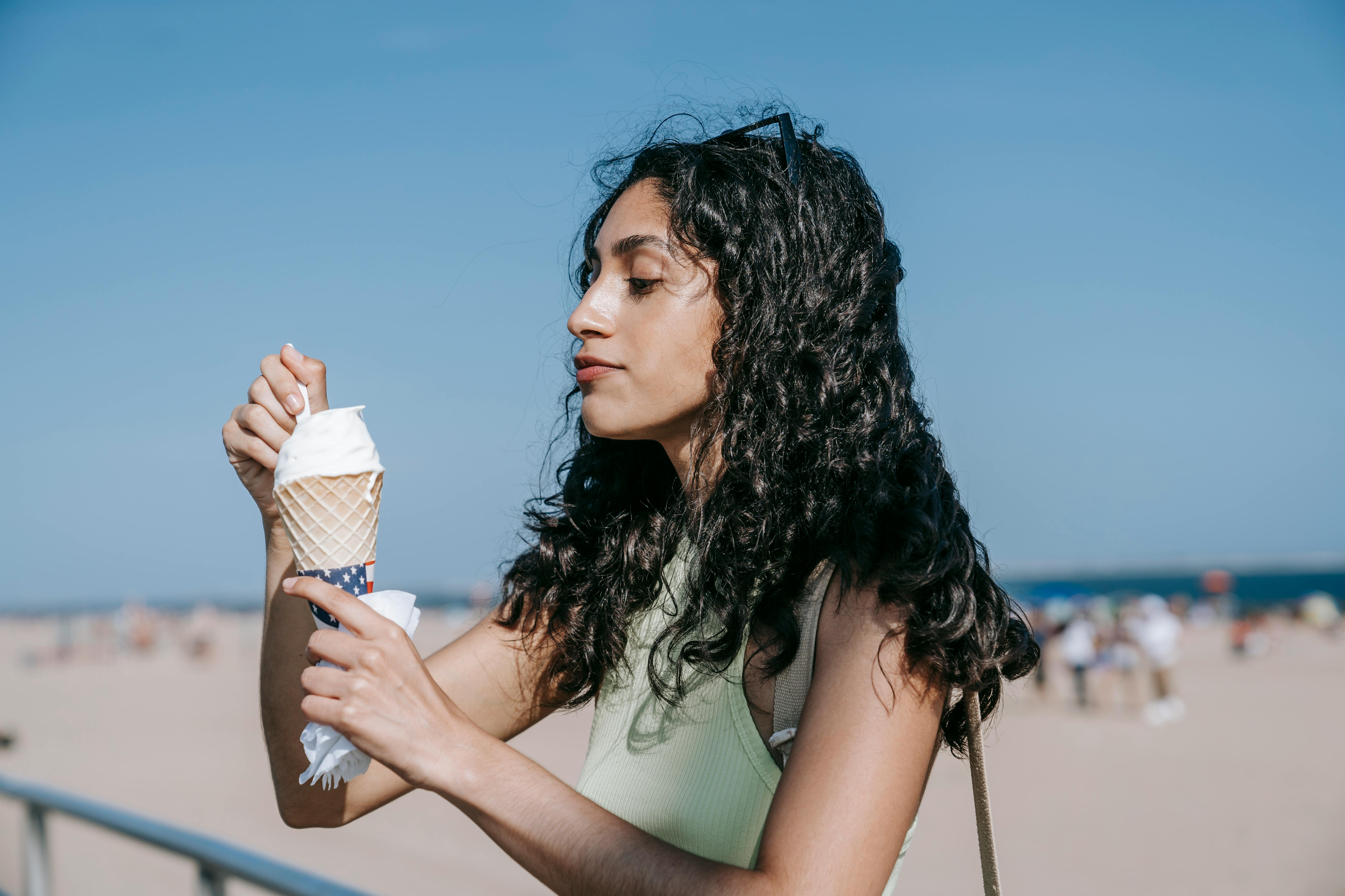 A Woman Eating Ice Cream · Free Stock Photo