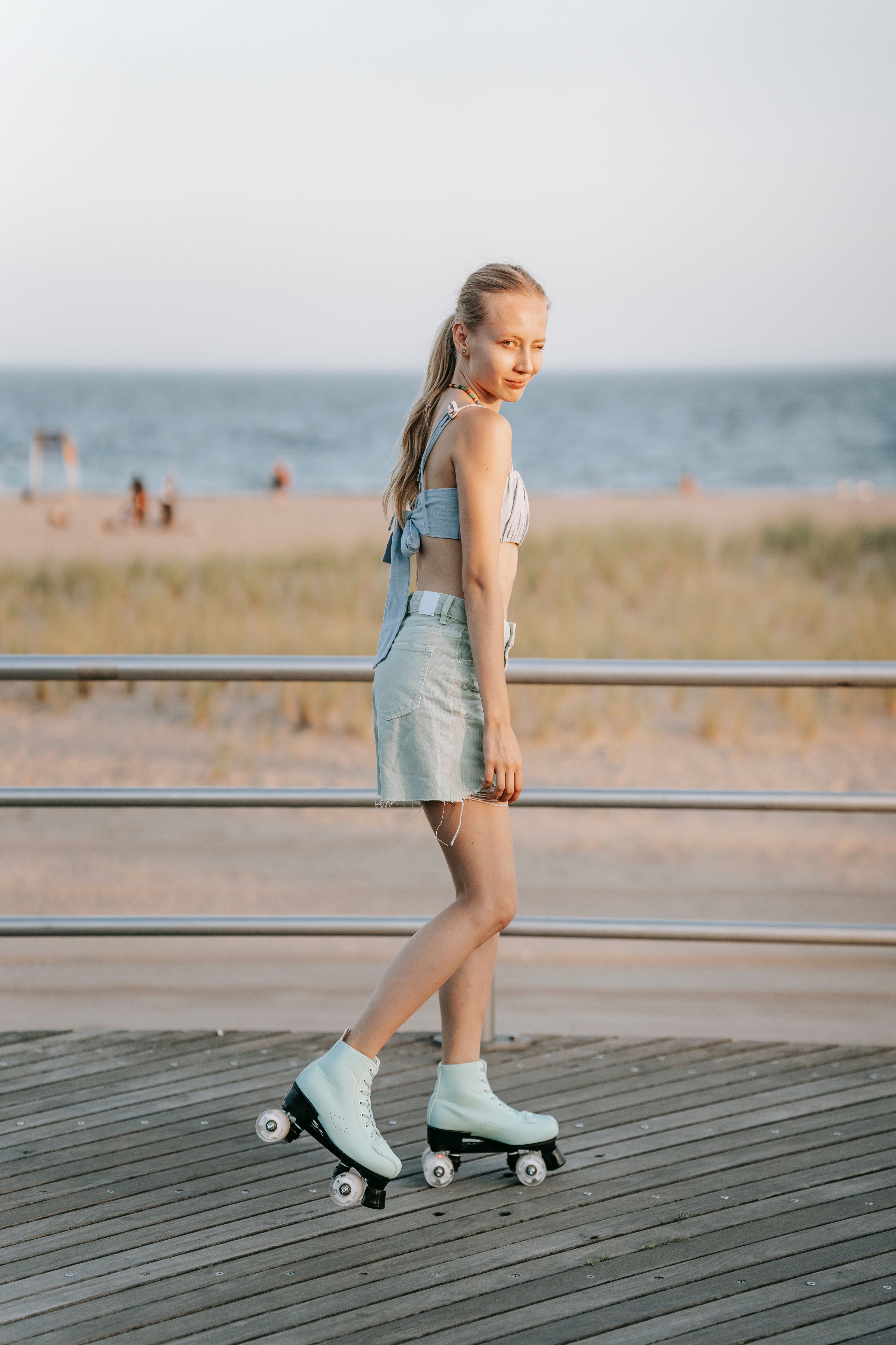 Woman Roller Skating on Pier · Free Stock Photo