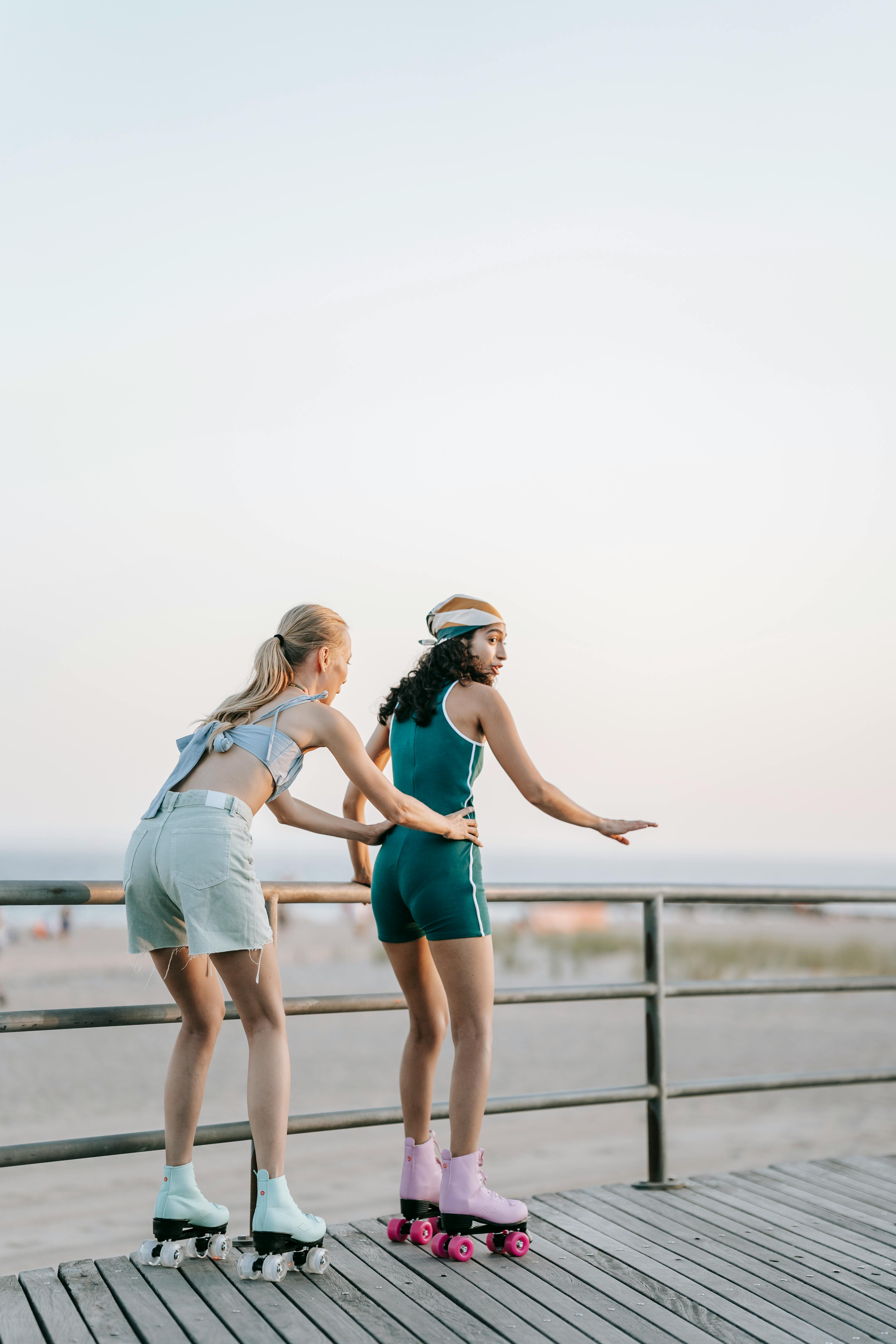 Two Girls Rollerskating Together · Free Stock Photo