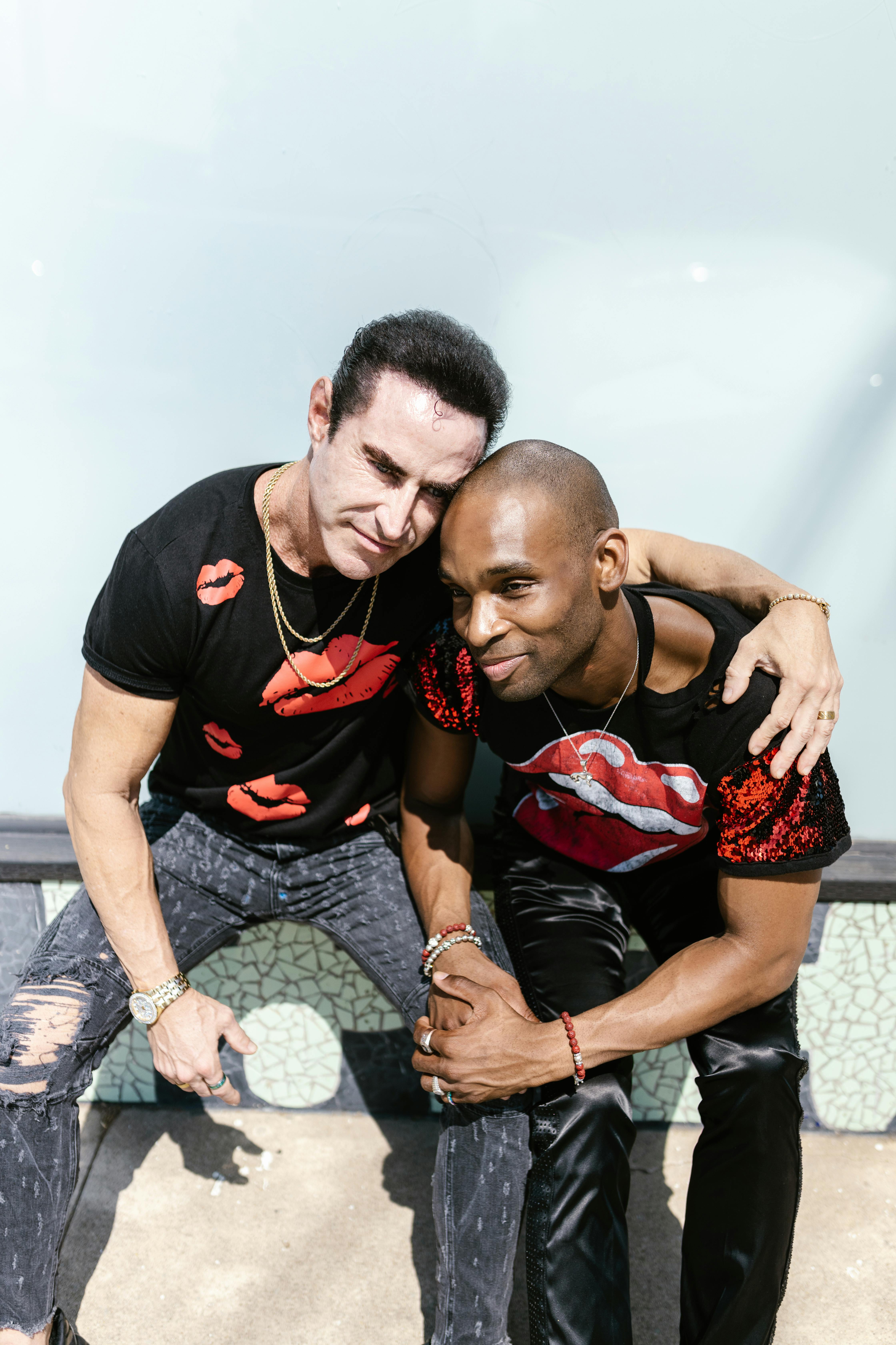 Photo of Man Leaning on Another Man · Free Stock Photo