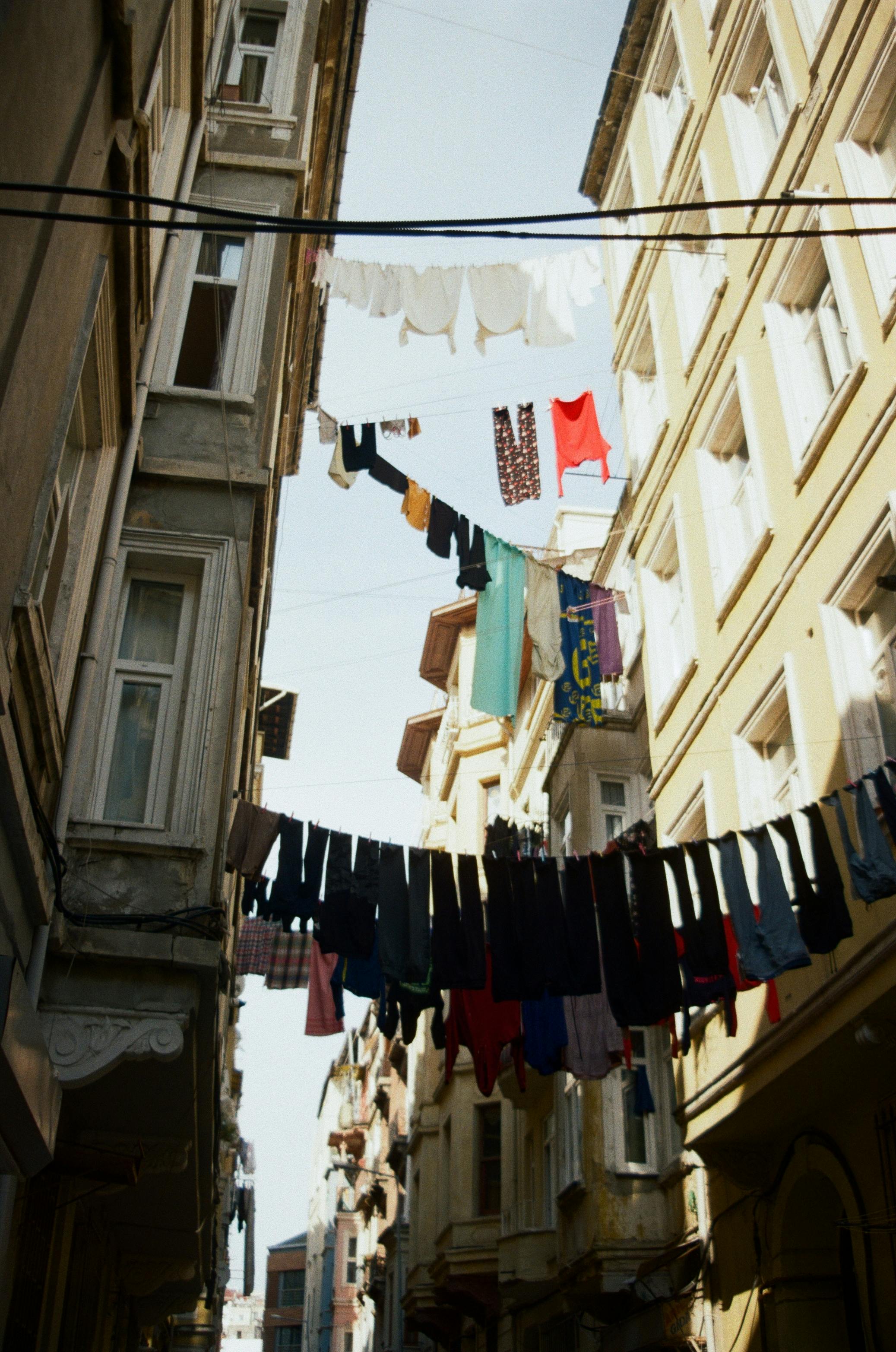 Clothes Hanged on Clothes Line Between Buildings · Free Stock Photo