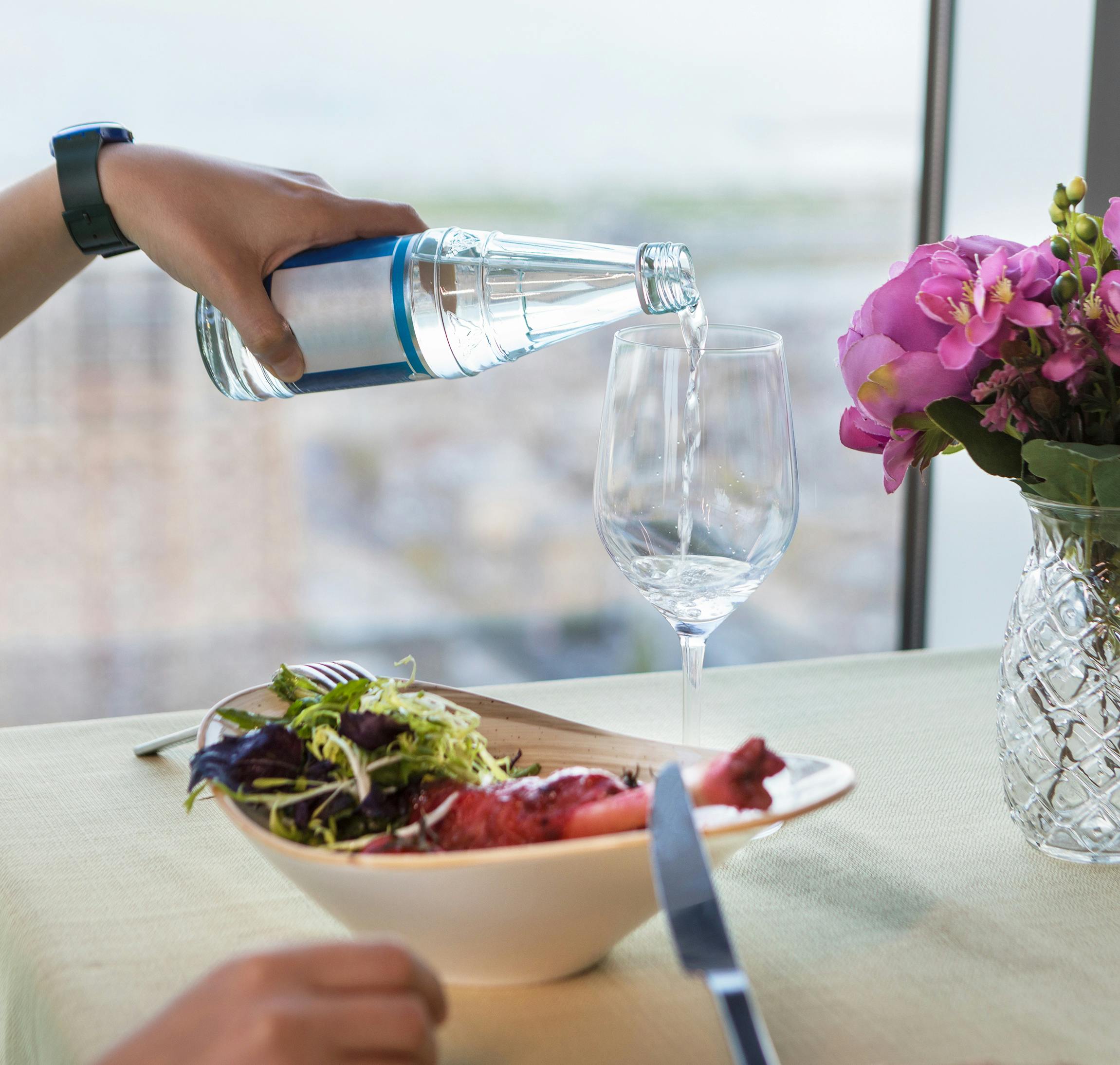 Person Pouring Water on a Glass · Free Stock Photo