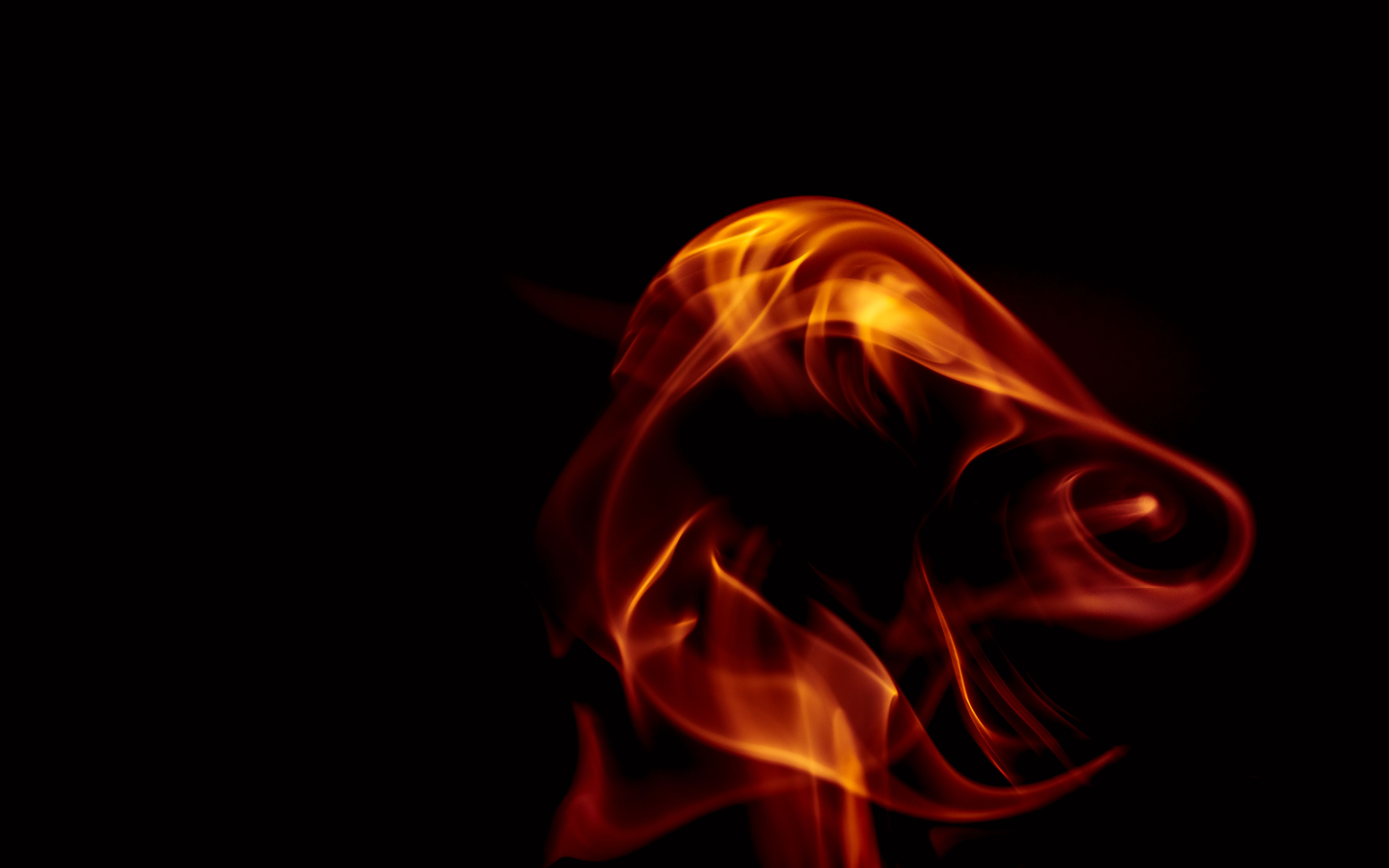 Person with Black Mask holding a Burning News Paper · Free Stock Photo