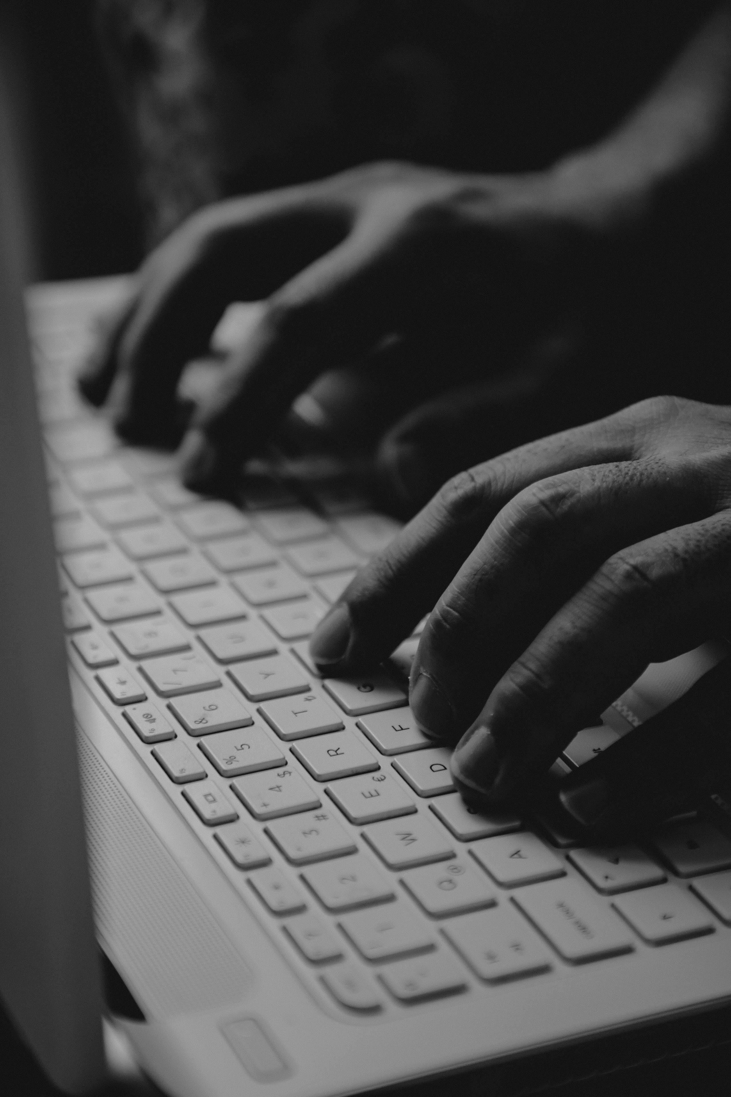 Person Typing a Laptop Computer · Free Stock Photo