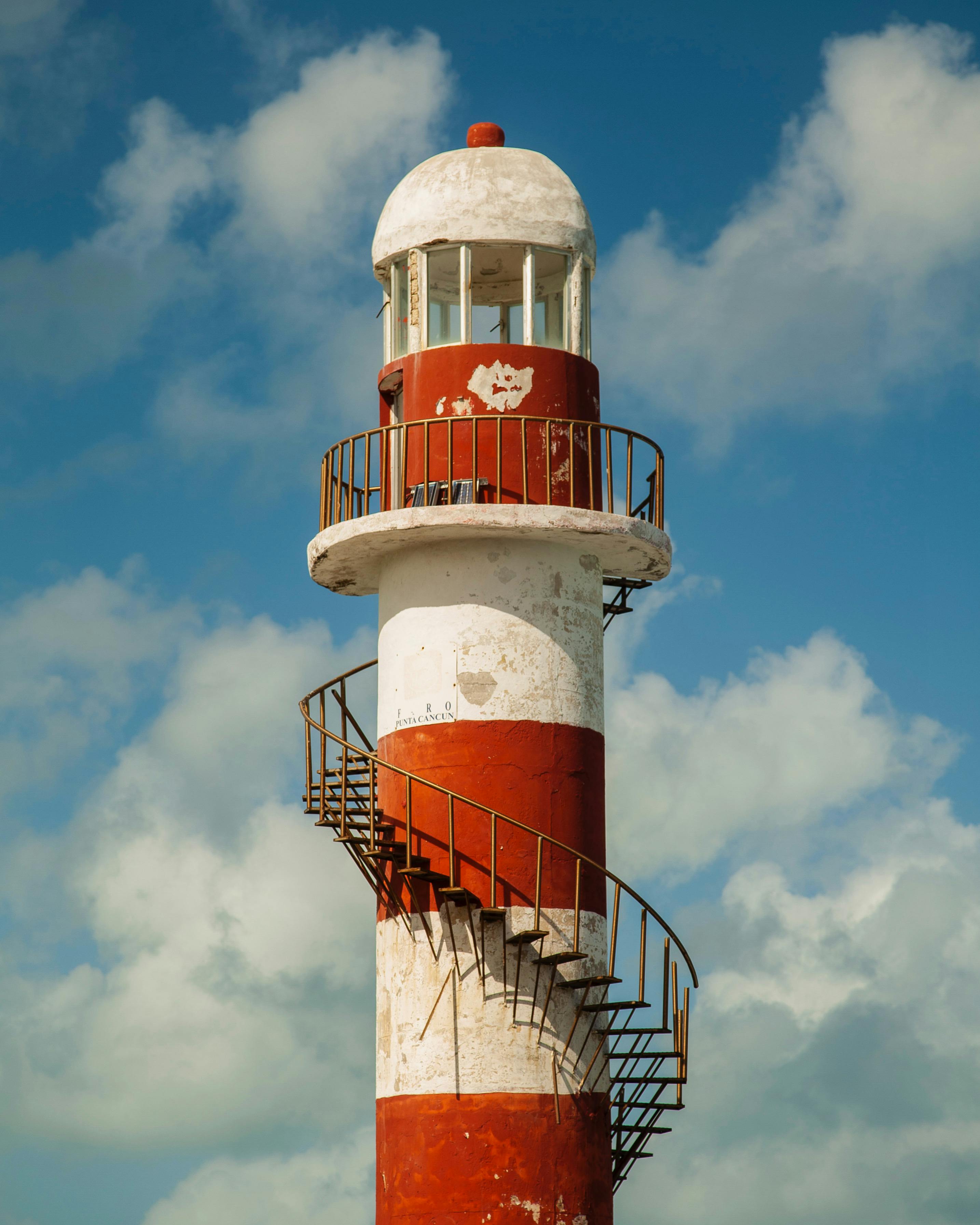 A White and Red Lighthouse · Free Stock Photo