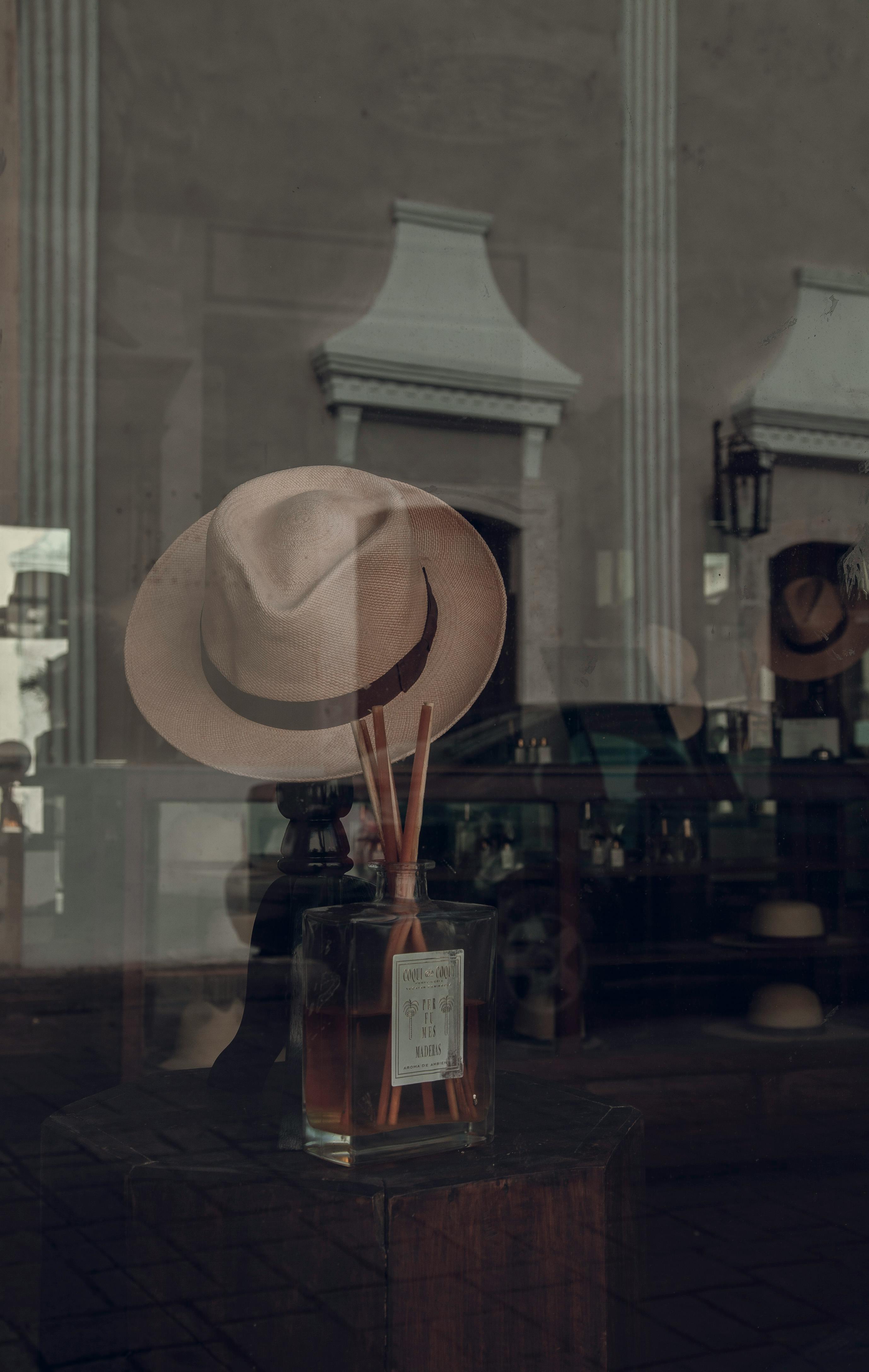 Brown Fedora Hat on Glass Display Cabinet · Free Stock Photo