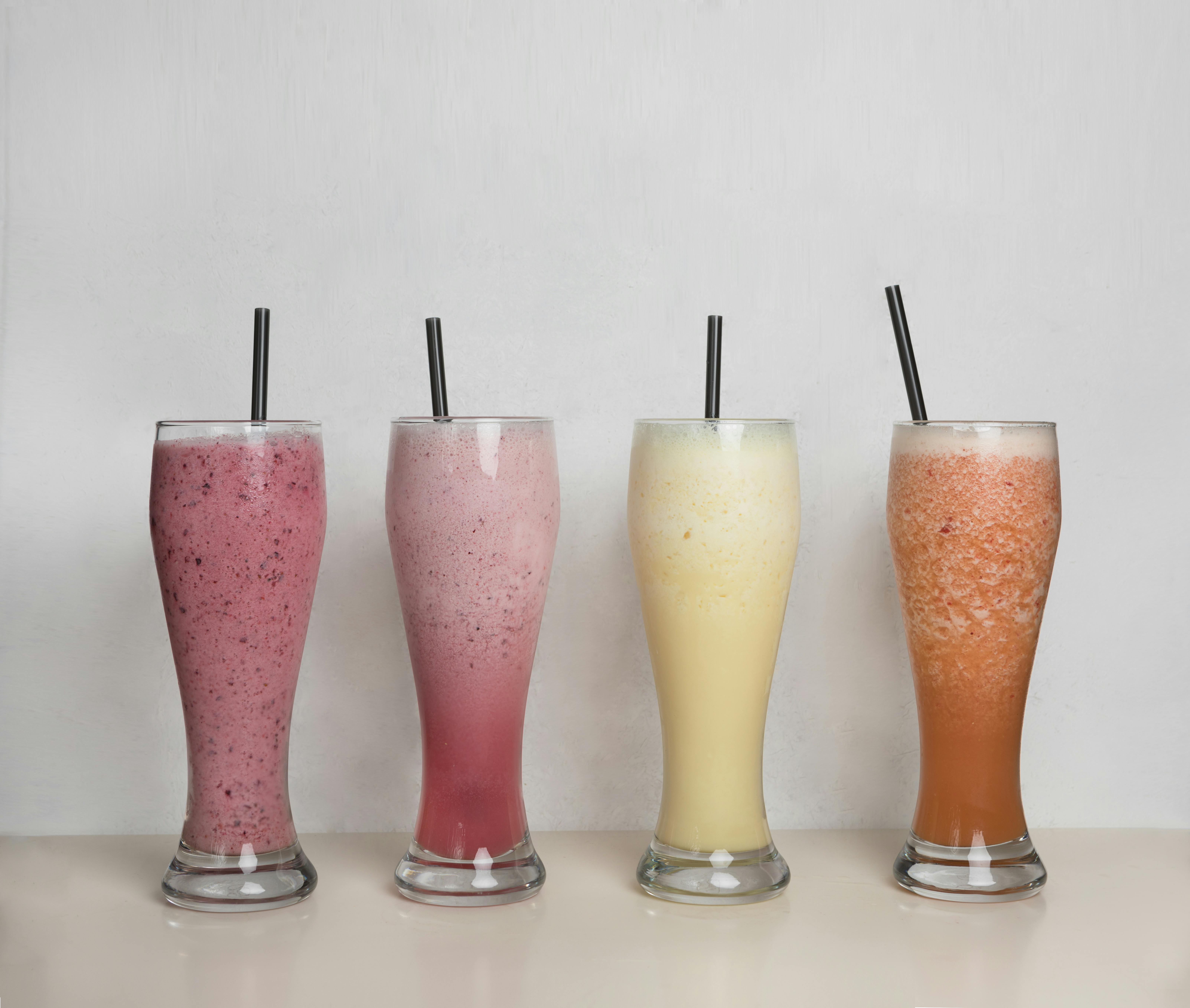 Assorted Flavor of Fruit Shakes on Tall Glasses · Free Stock Photo