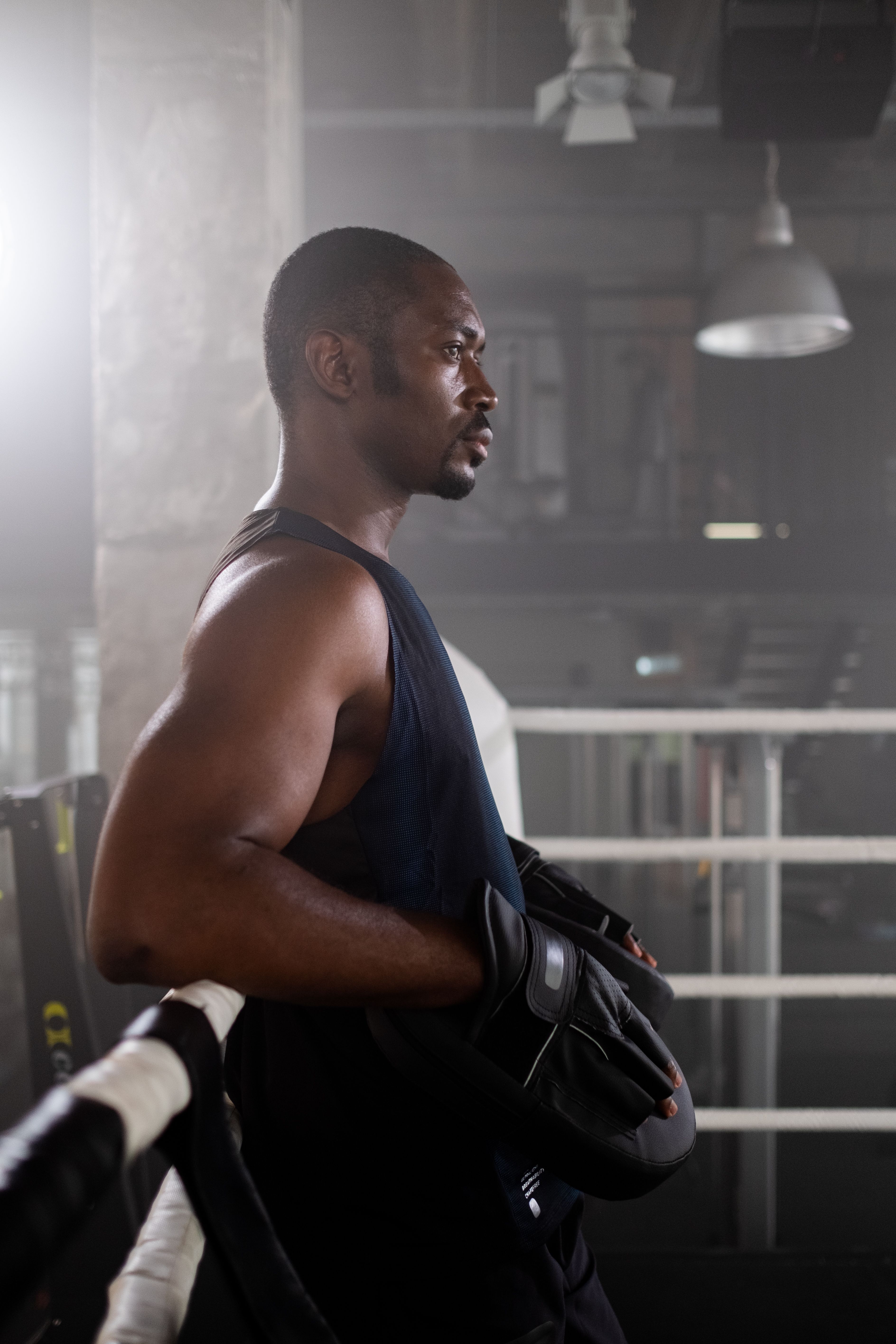 A Man Wearing Focus Mitts while Leaning on Boxing Ring Ropes · Free ...
